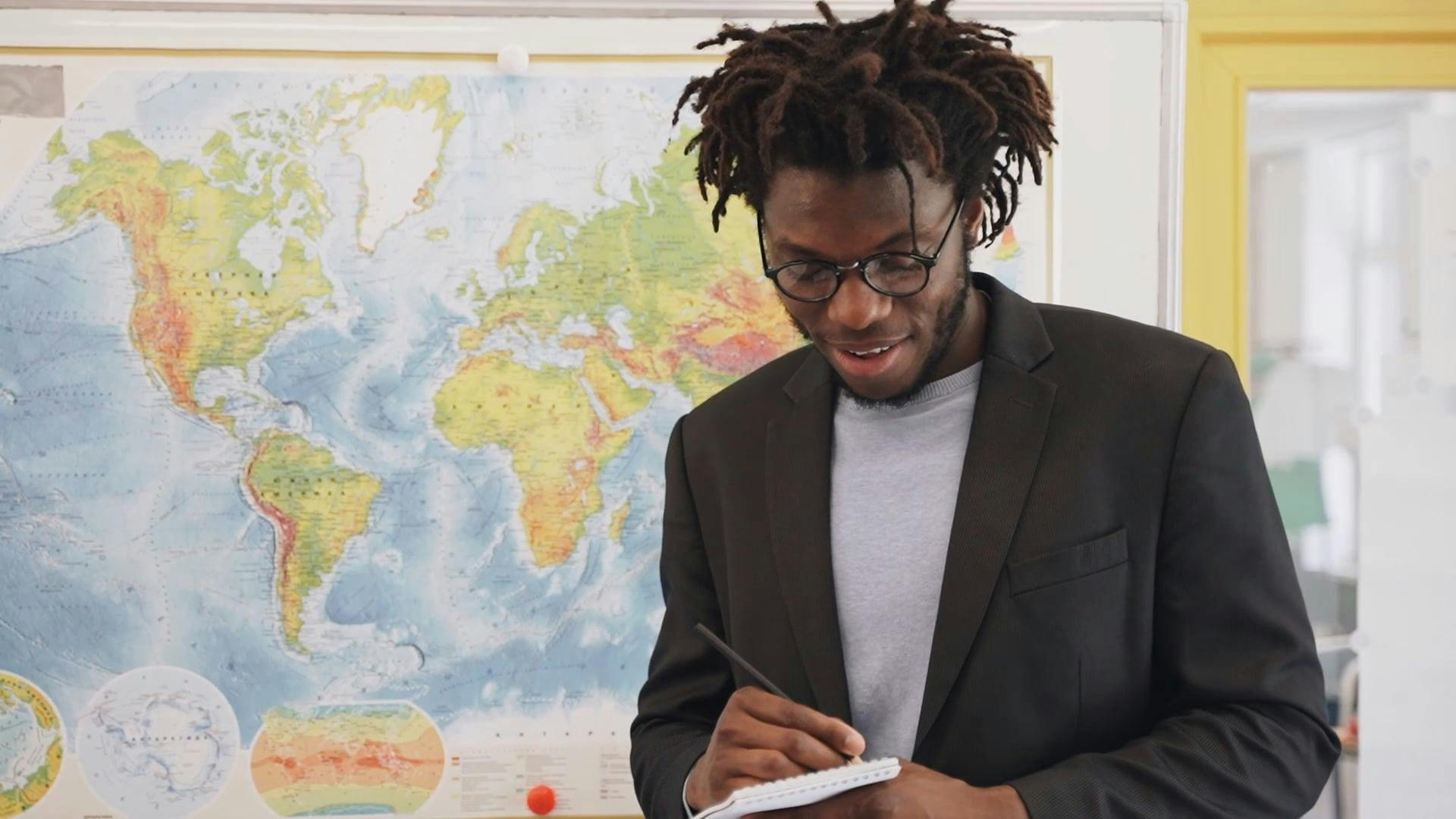 Man with Braided Hair Writing on a Notepad Free Stock Video Footage ...
