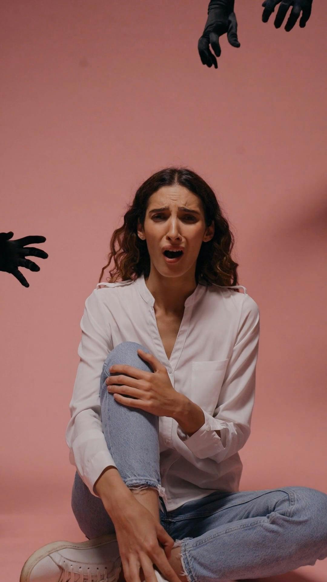 A Scared Woman Surrounded by Hands · Free Stock Video