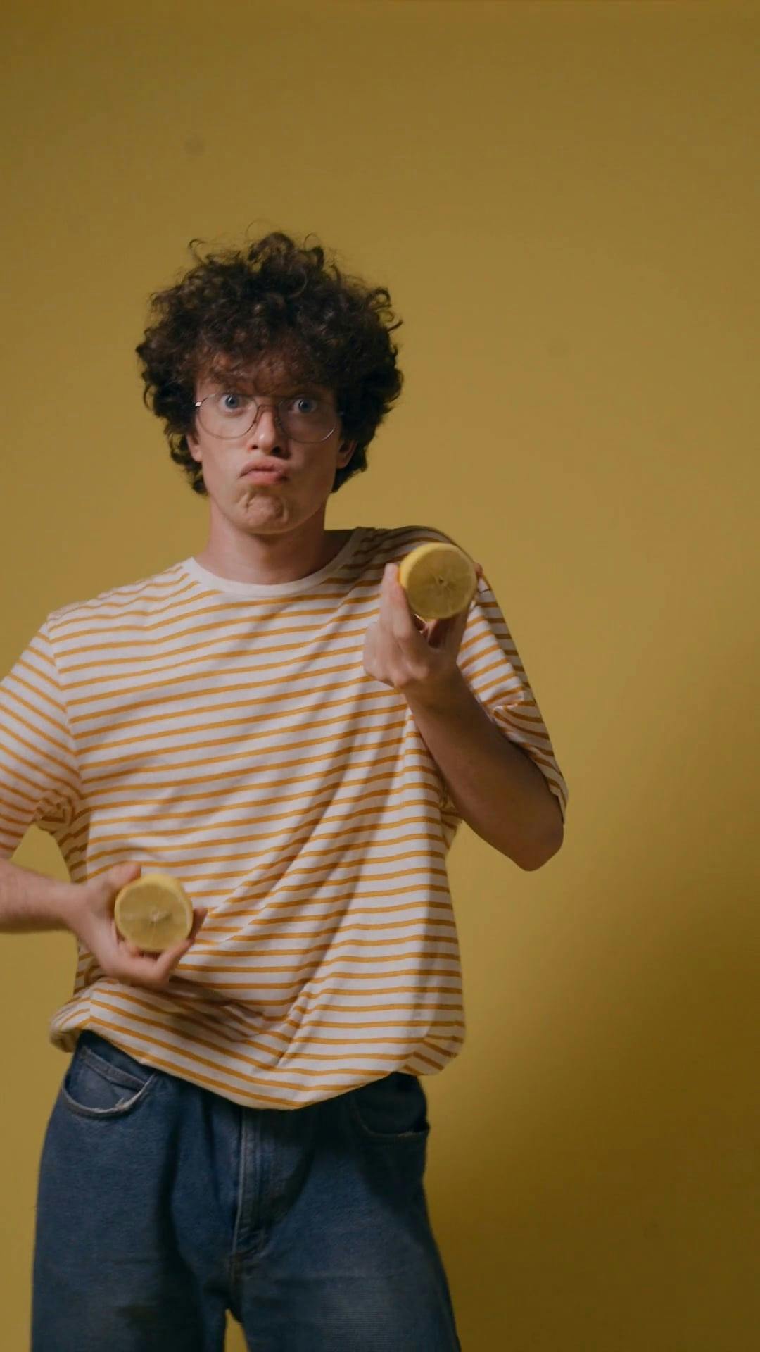 A Man Holding a Sliced Lemon while Dancing Free Stock Video Footage ...