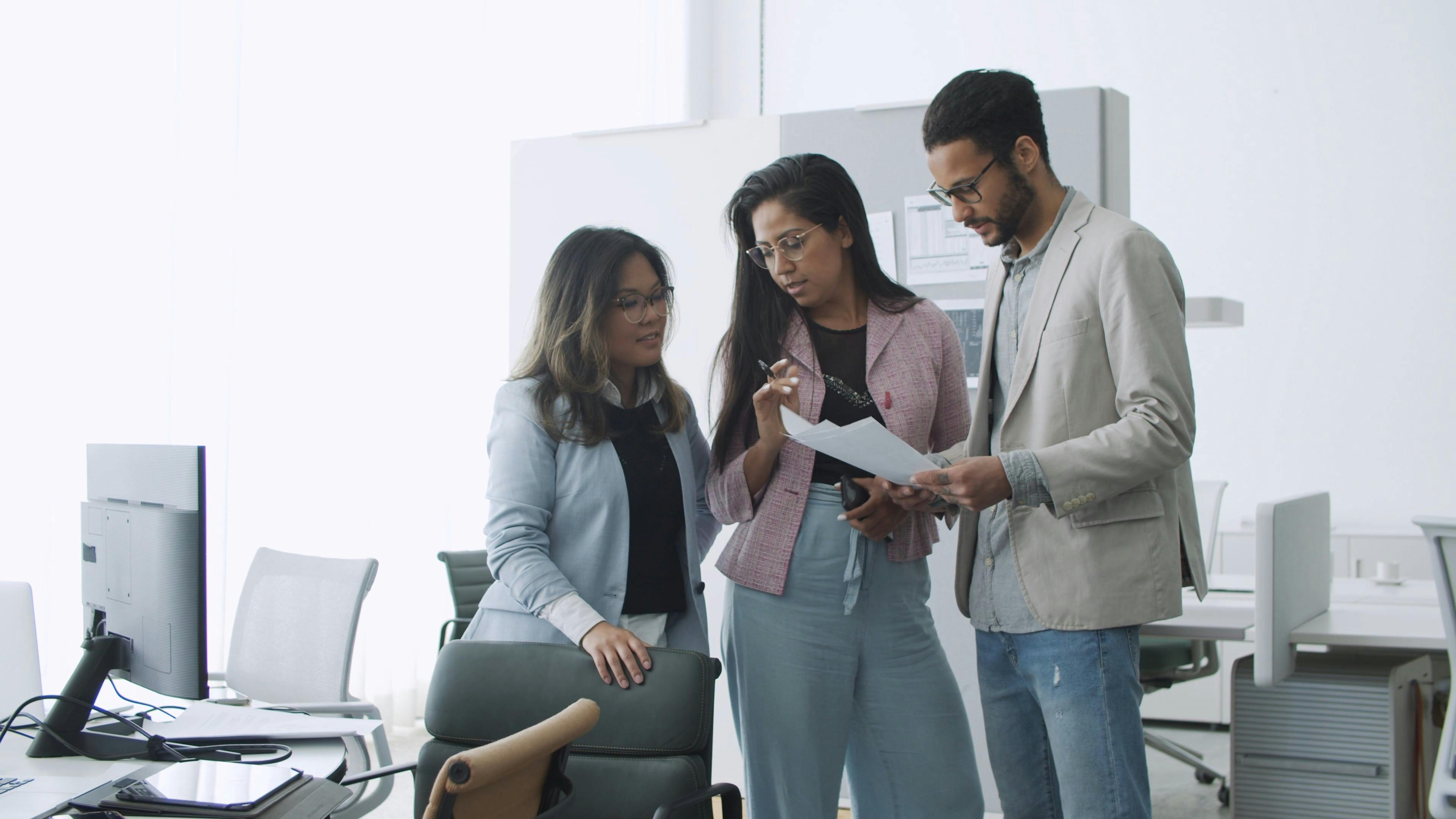 Colleagues having Meeting while Discussing a Report Paper · Free Stock ...