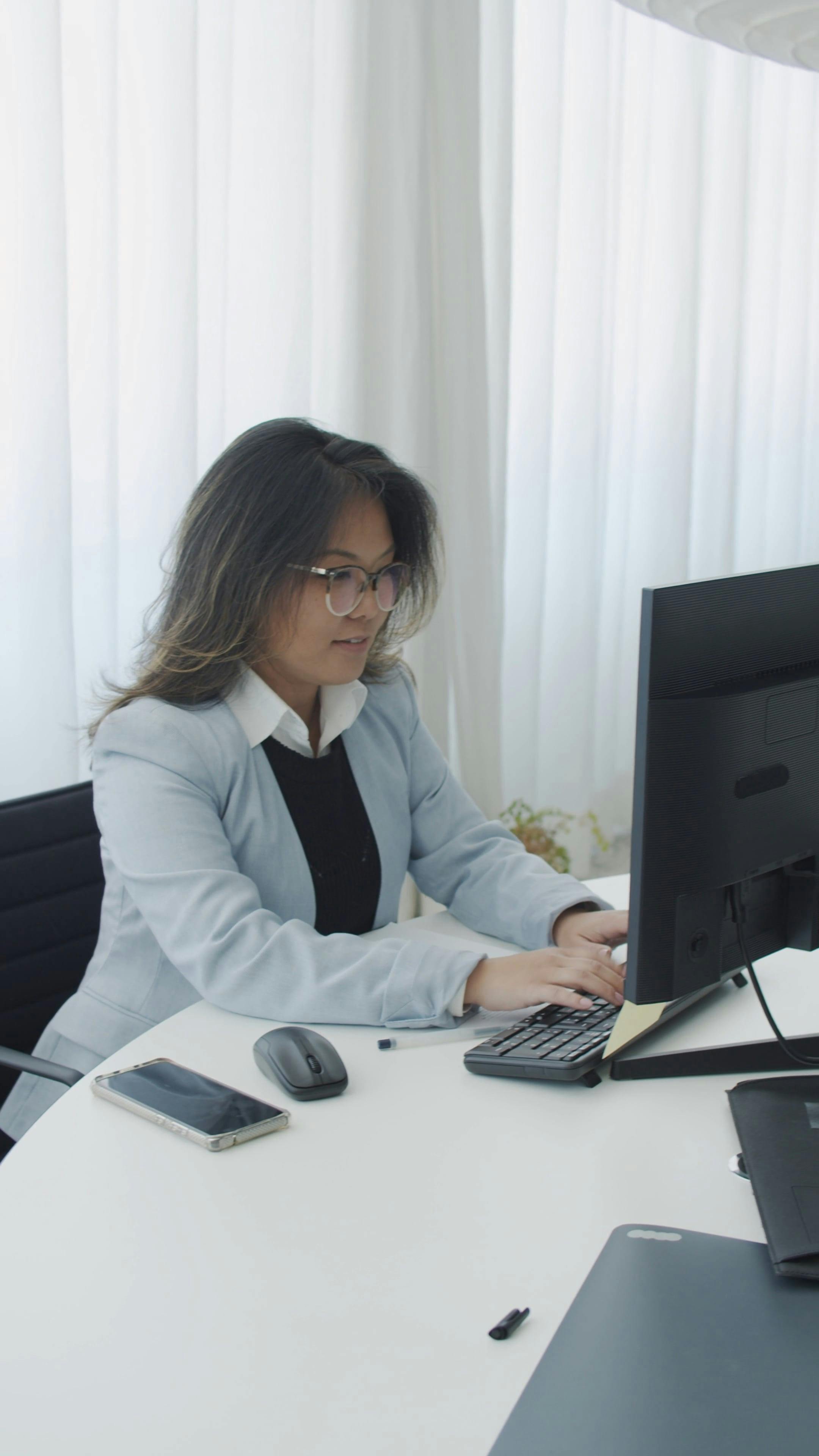 A Woman Working Using a Computer · Free Stock Video