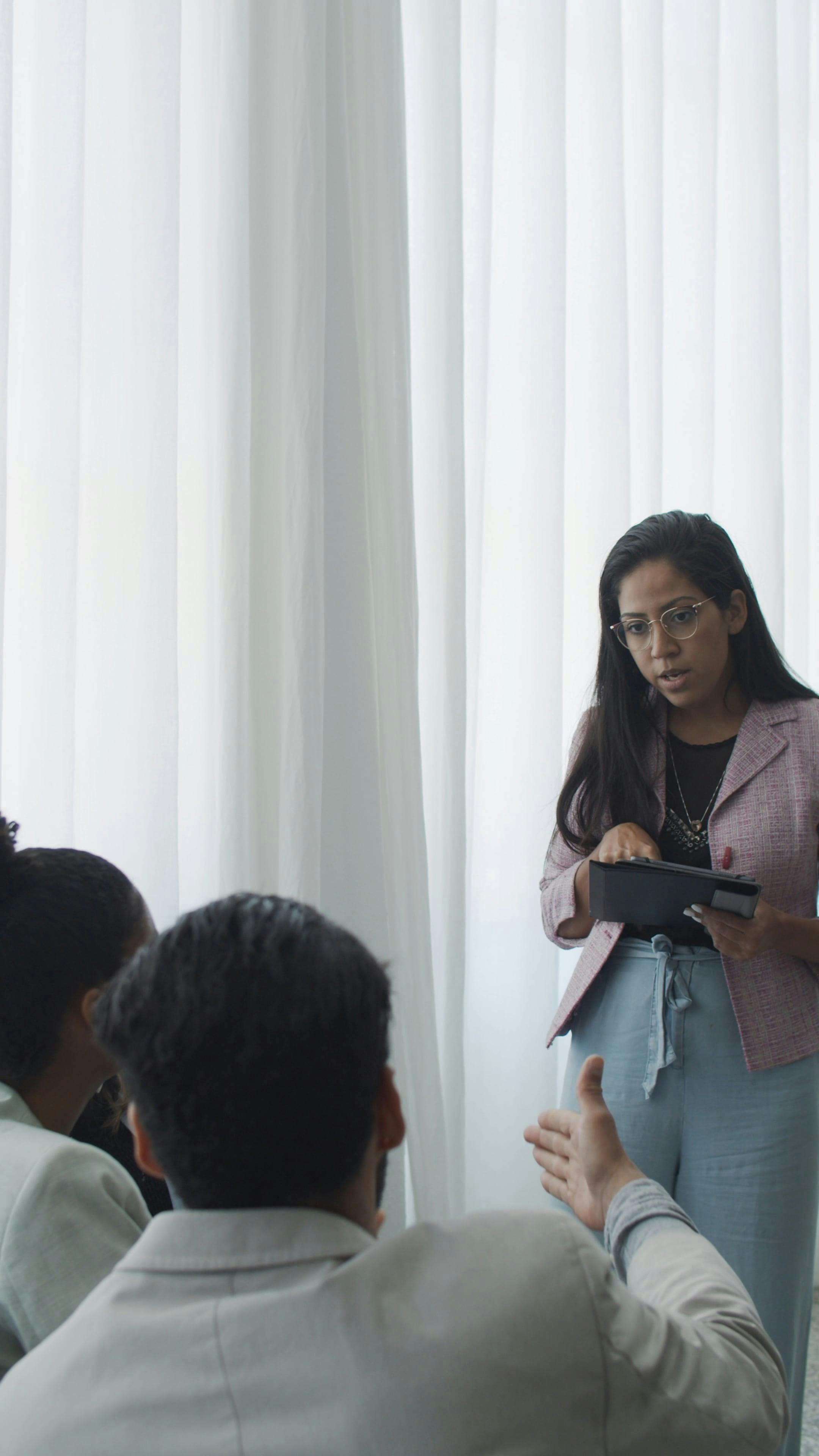 A Woman Discussing in a Meeting · Free Stock Video