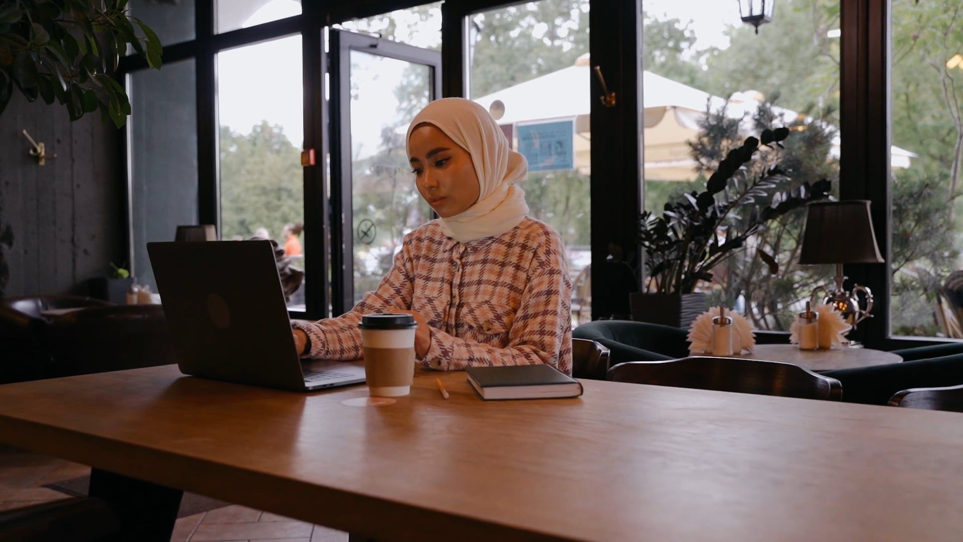Woman in a Coffee Shop Writing on a Notebook Free Stock Video Footage ...