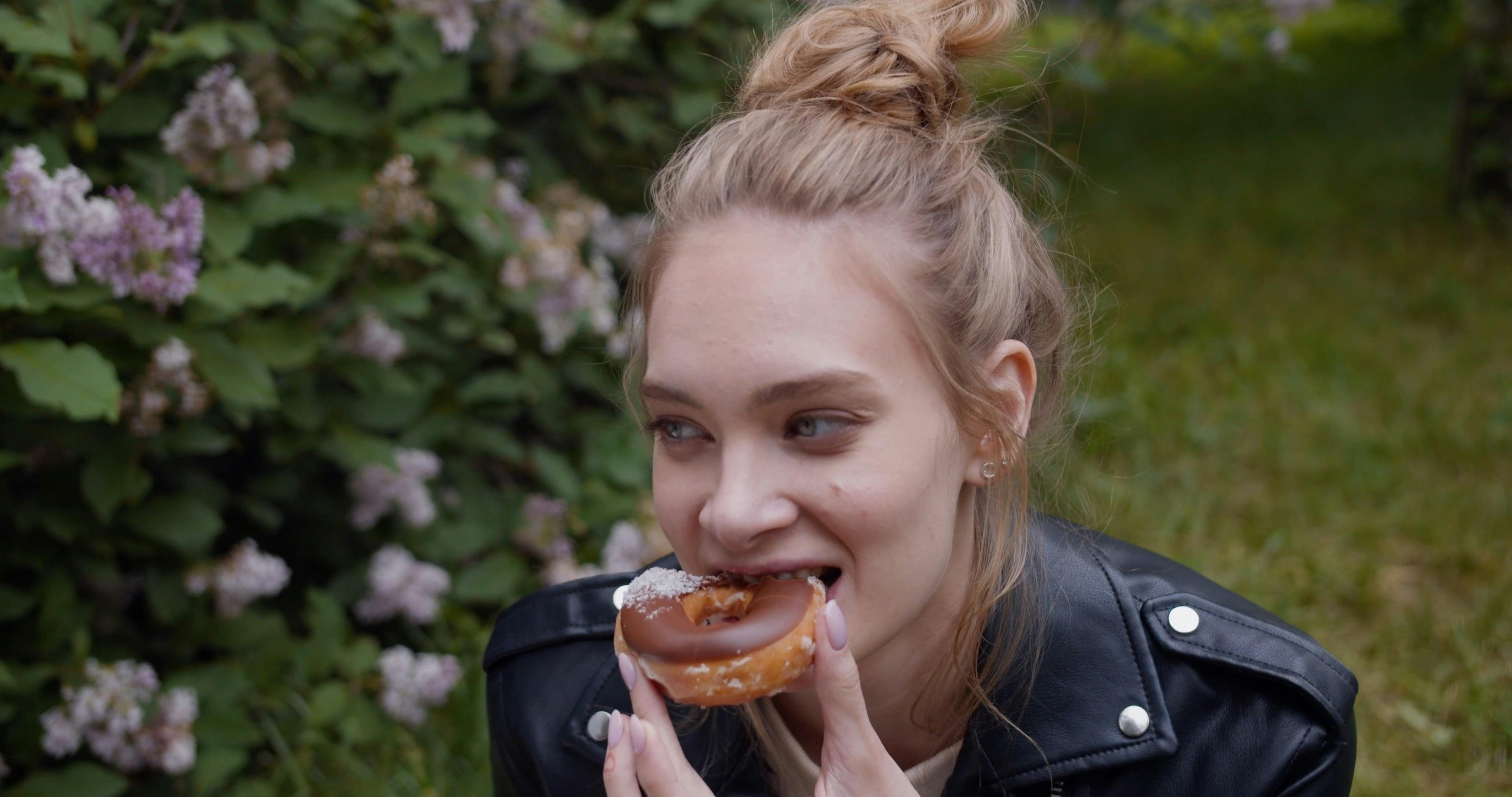Woman Eating a Donut Free Stock Video Footage, Royalty-Free 4K & HD ...