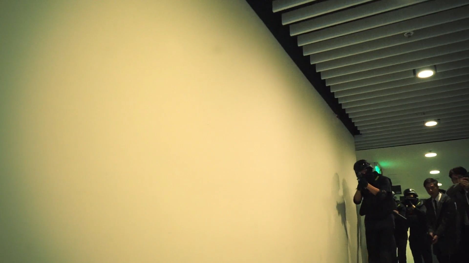 Uniformed People Slowly Walking on the Hallway While Holding Guns ...