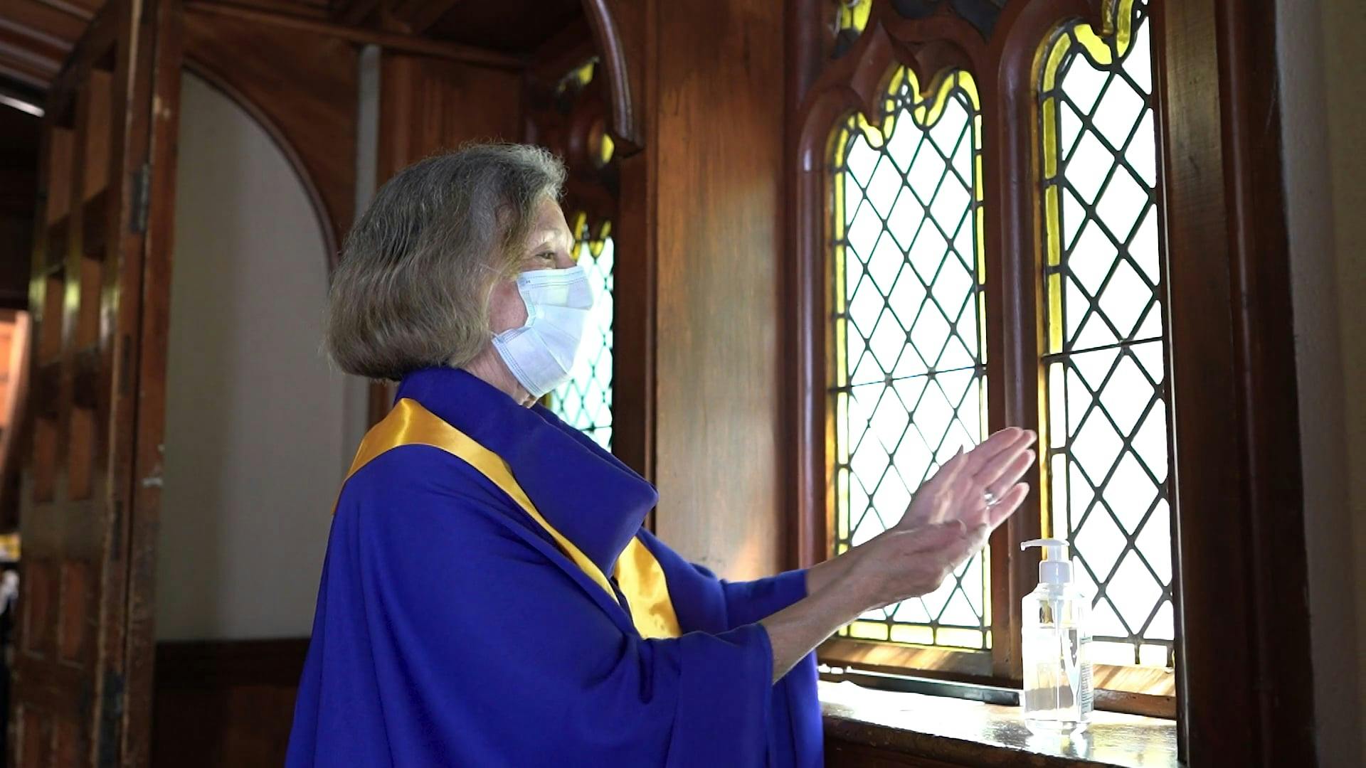 A Pastor in a Face Mask Sanitizing her Hands Free Stock Video Footage ...