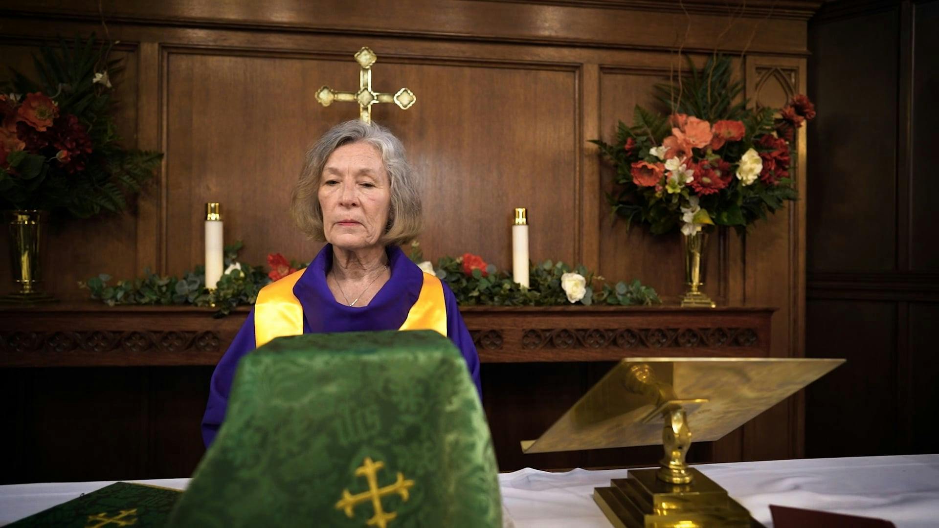 Woman Pastor In Purple Robe Standing Behind The Altar Free Stock Video ...