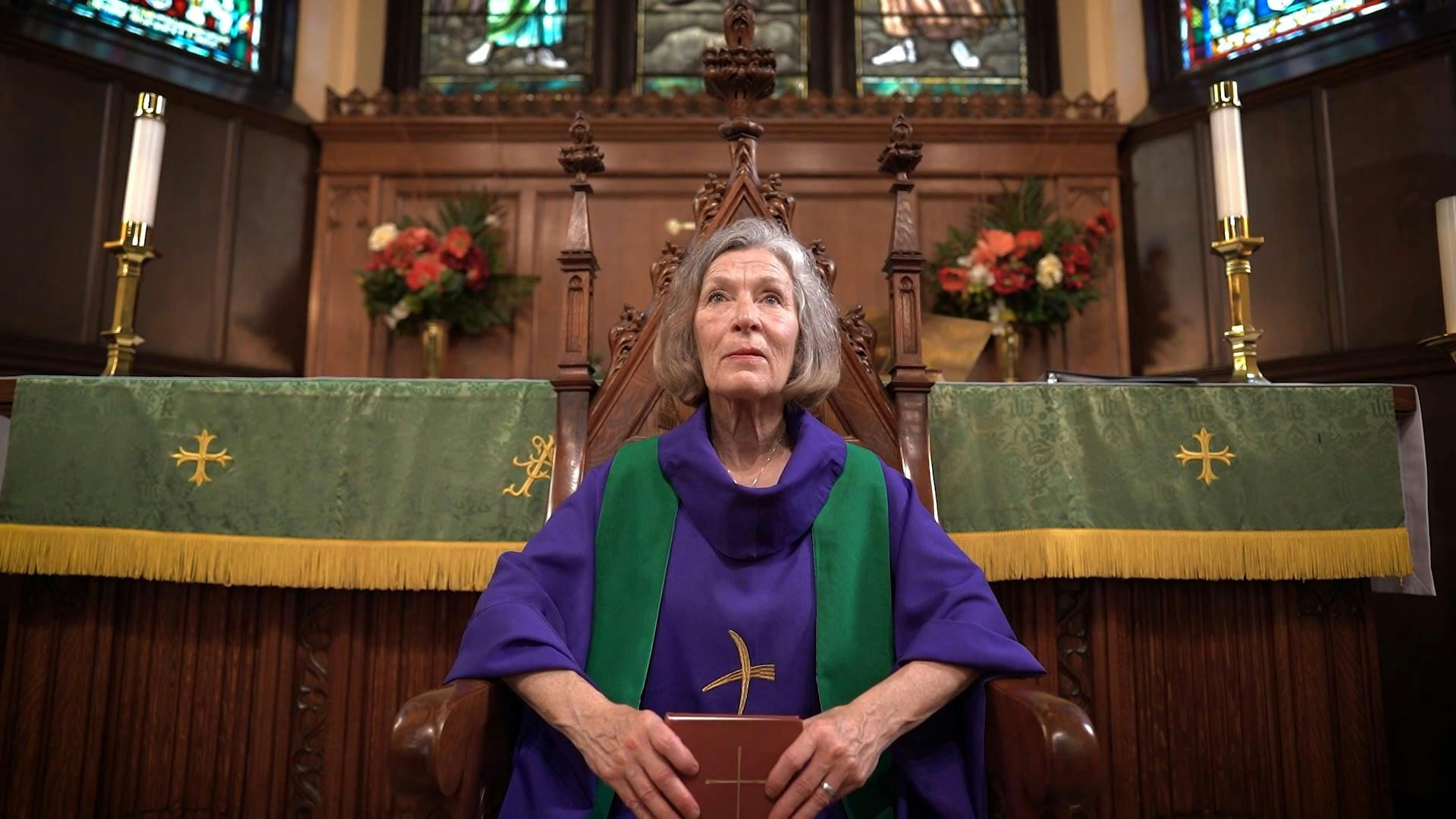 Woman Pastor Sitting In Front Of The Altar With A Holy Book Free Stock ...