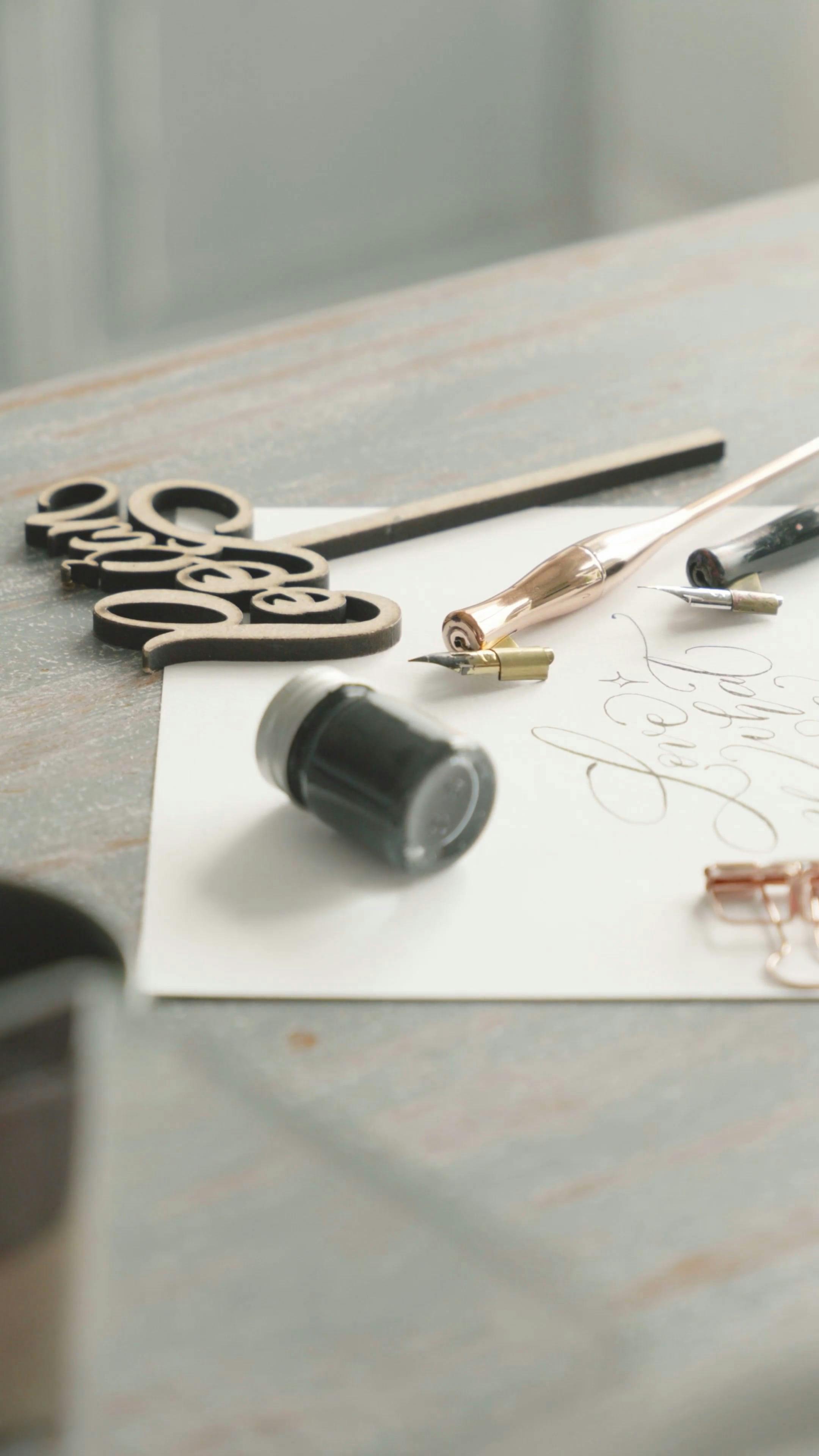 Papers with Calligraphy on a Table · Free Stock Video