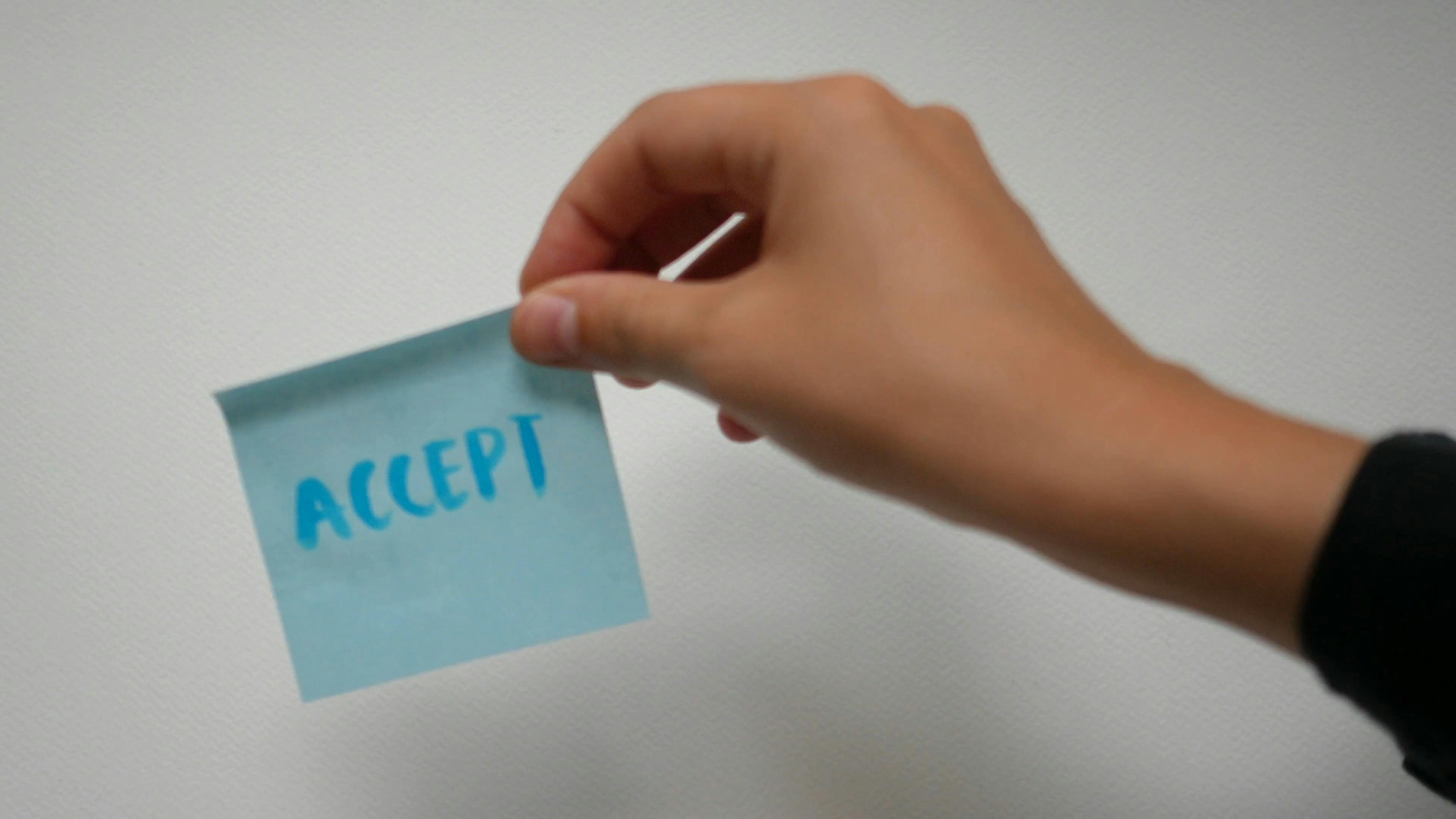 A Person Sticking Sticky Notes · Free Stock Video