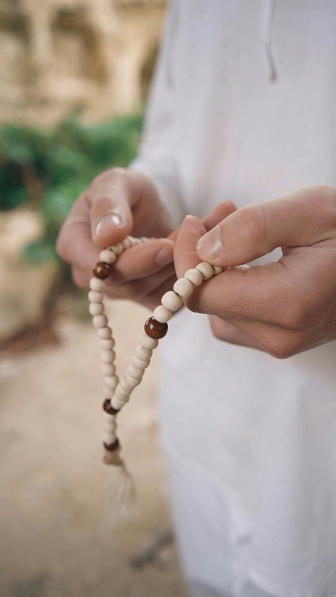 A Person Holding Beads · Free Stock Video