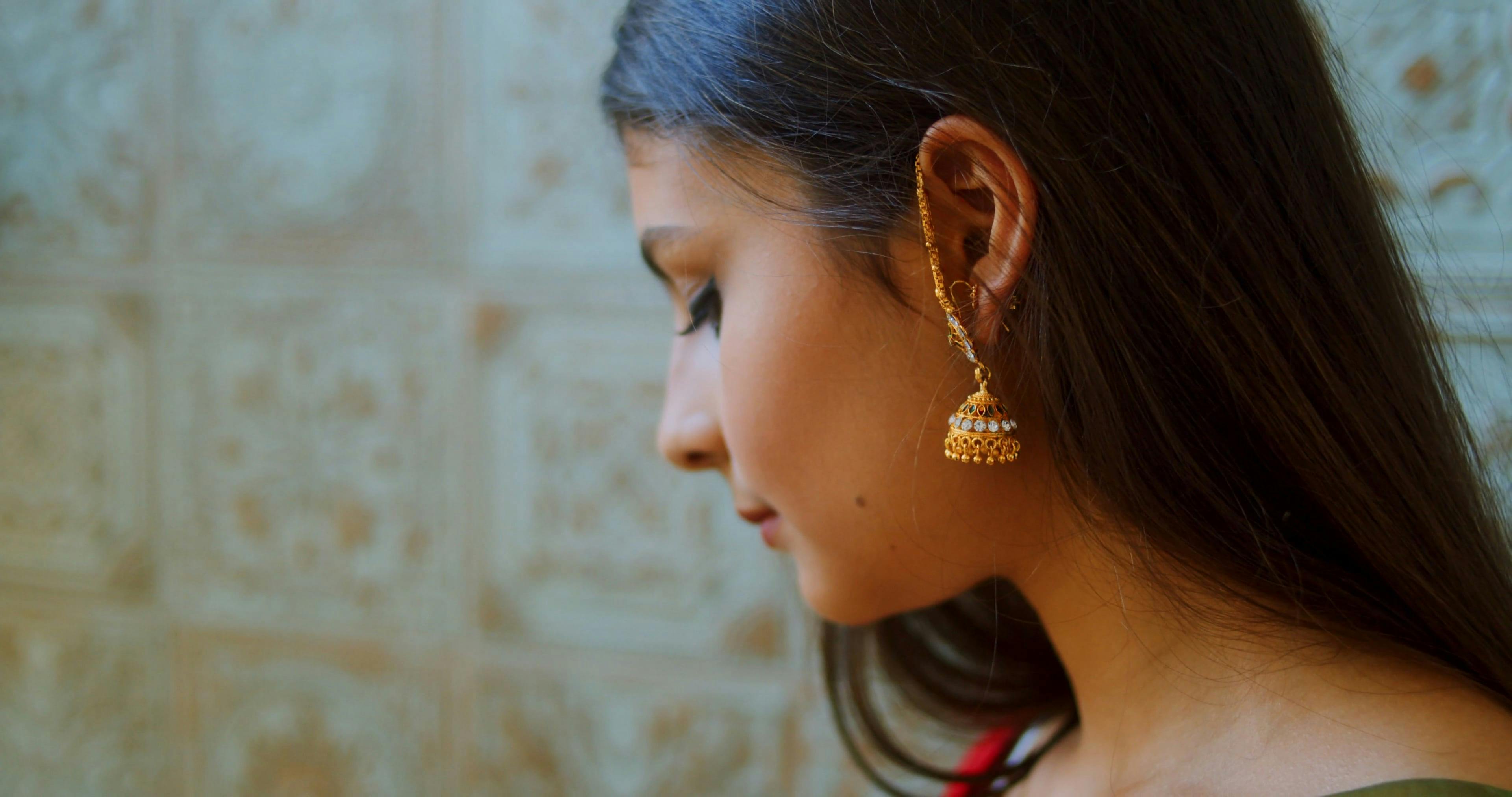 Side View Footage of a Young Woman Wearing Traditional Earing Free ...
