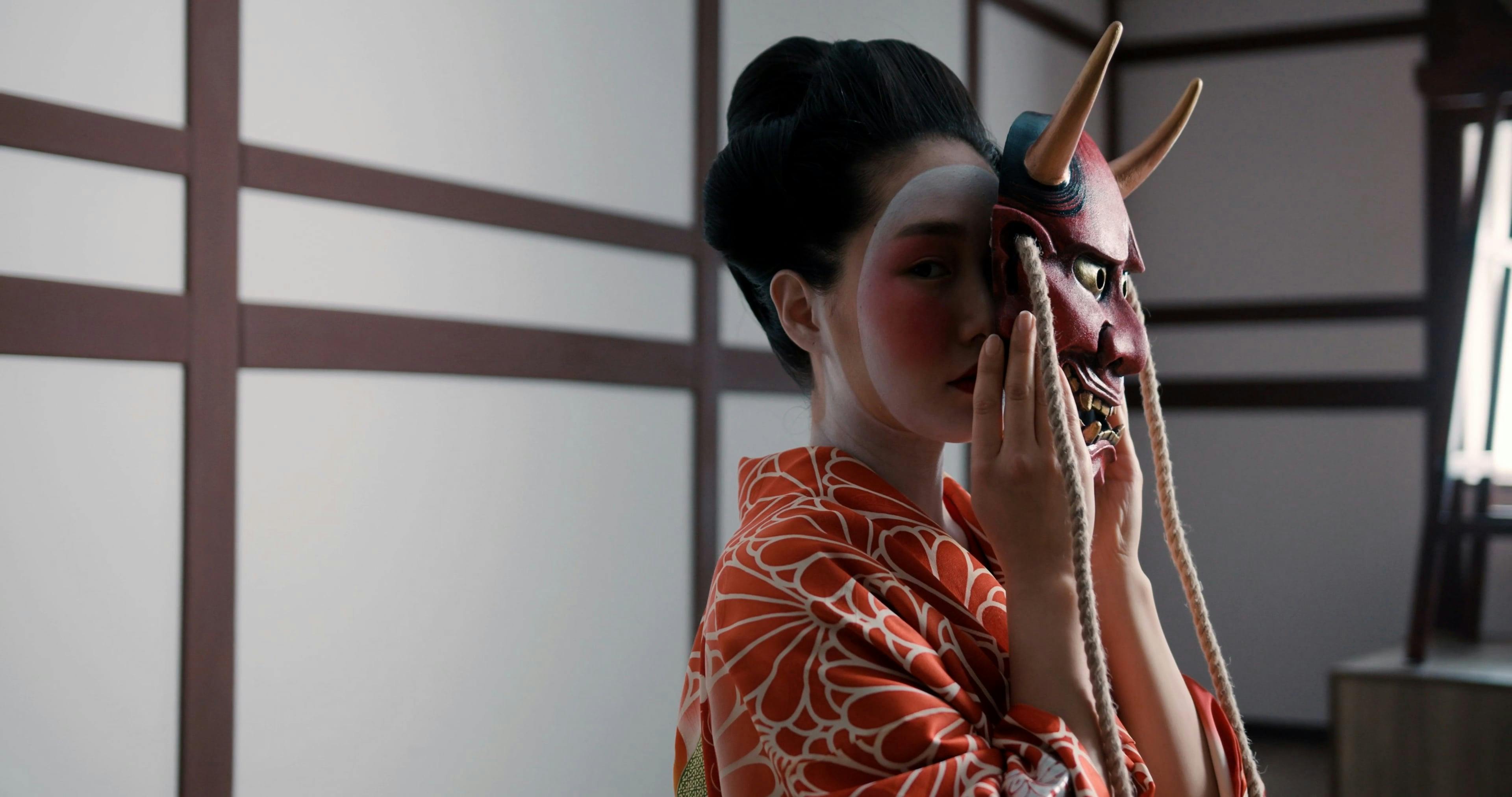 A Geisha Covering Her Face With a Hannya Mask Free Stock Video Footage ...