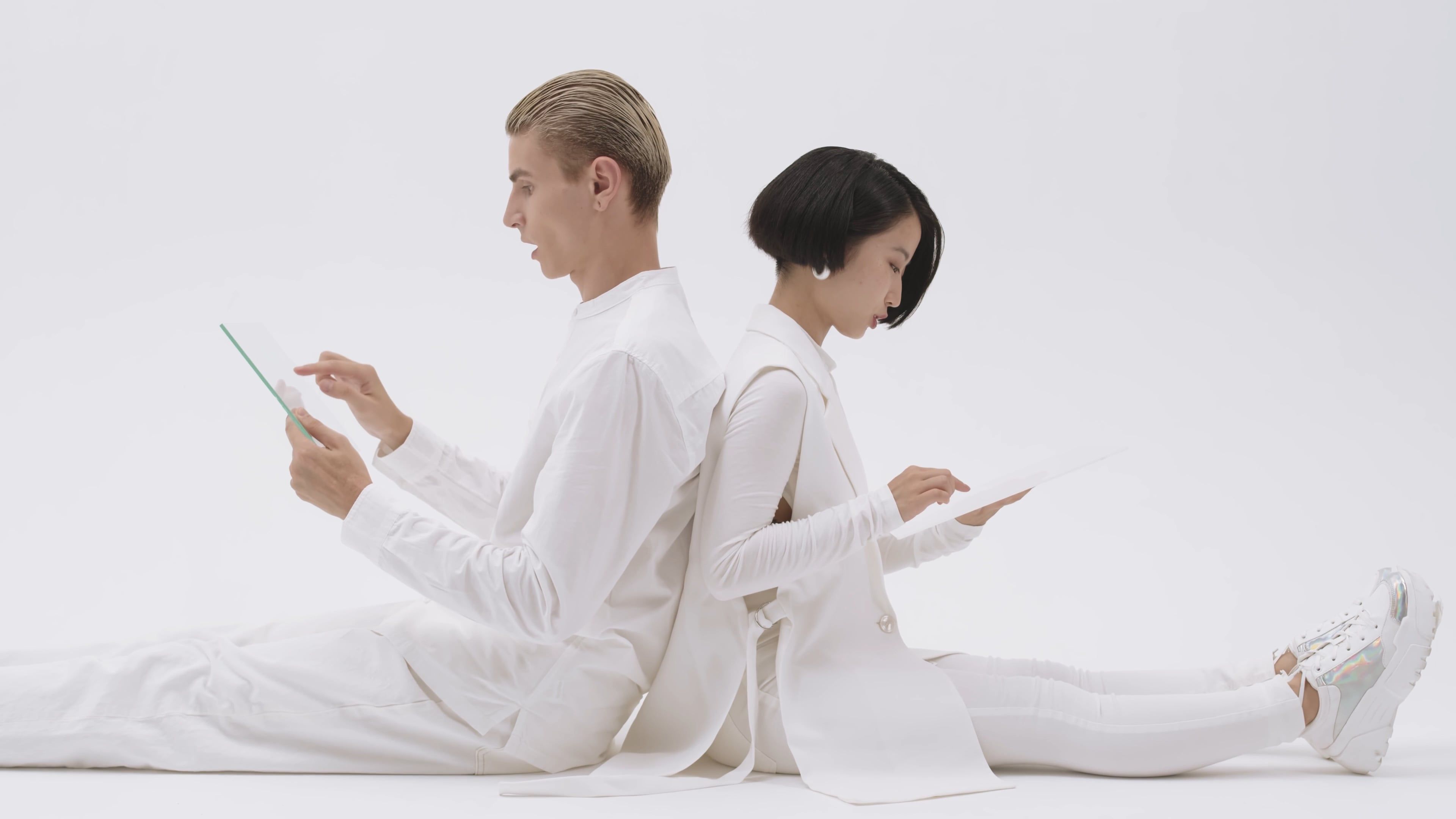 Man and Woman Back to Back Using Technology Free Stock Video Footage ...