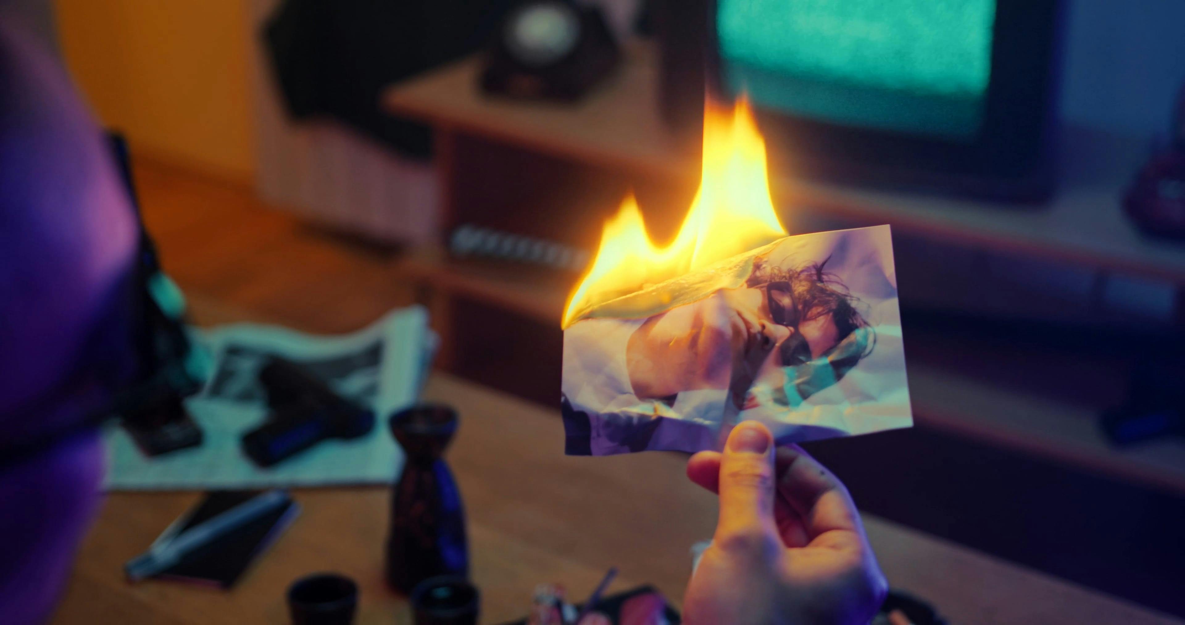 Man Burning a Picture · Free Stock Video