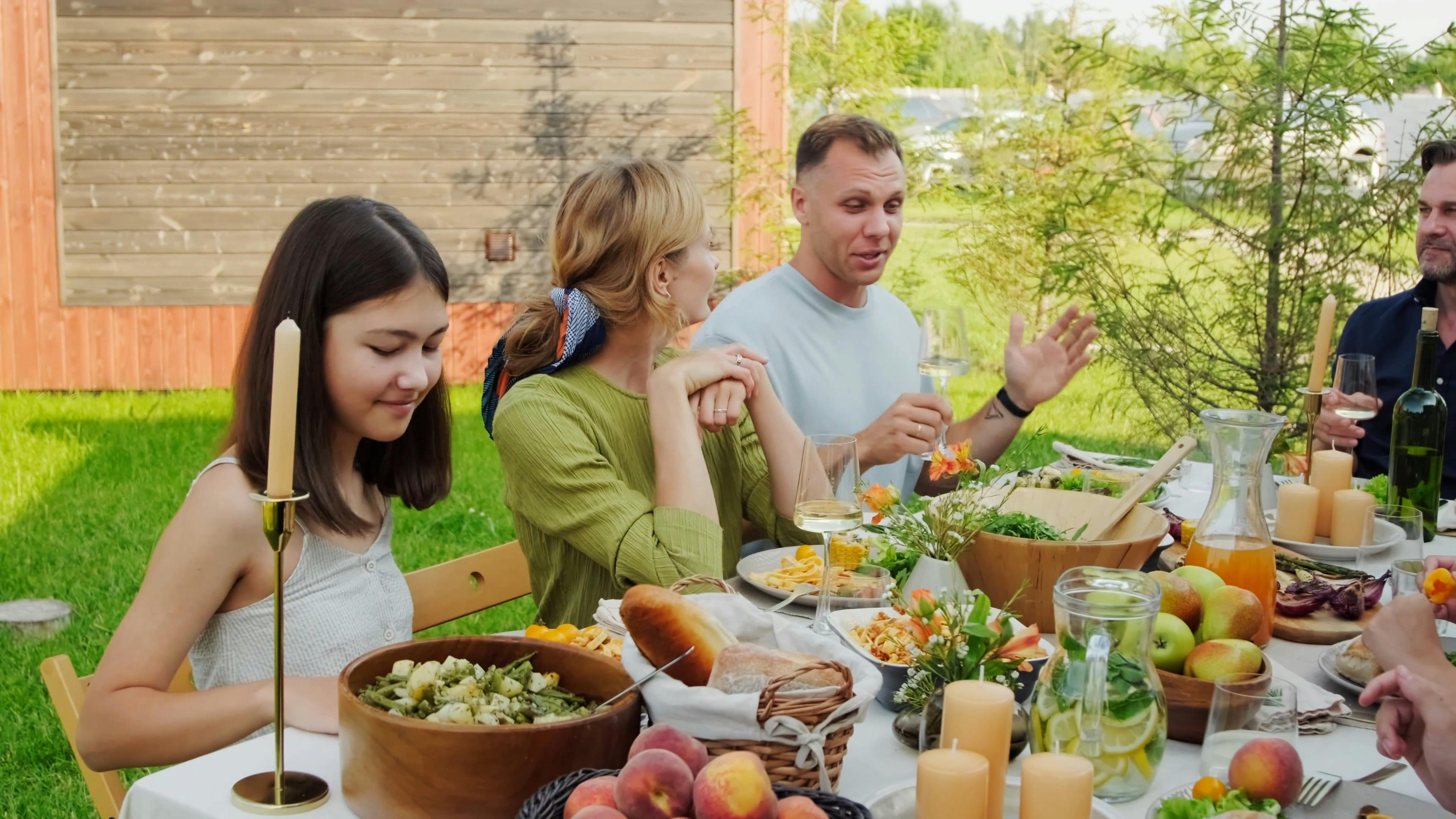 Happy Family Talking at a Dinner Table Free Stock Video Footage ...