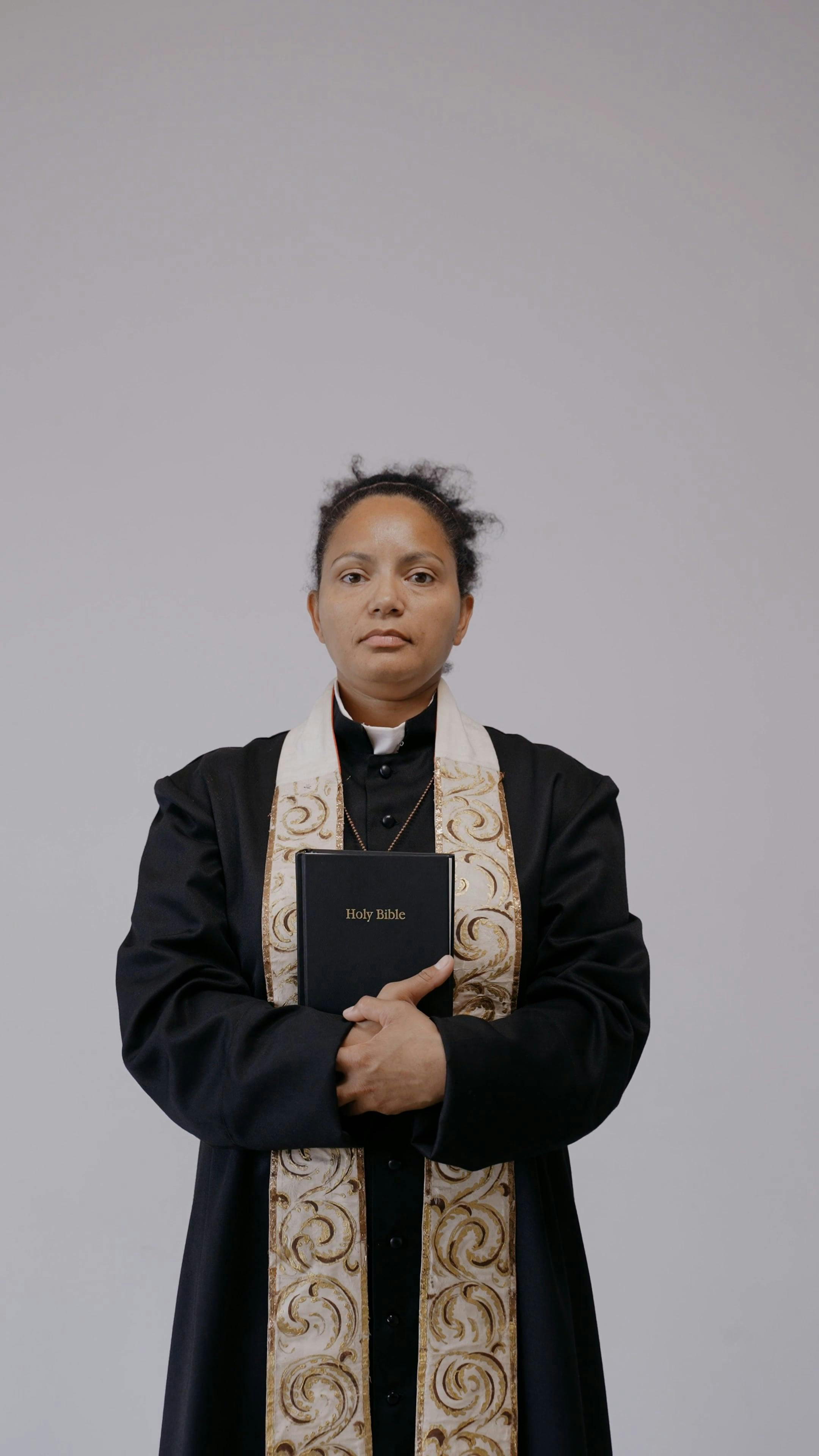 Female Pastor Holding a Holy Bible Free Stock Video Footage, Royalty ...