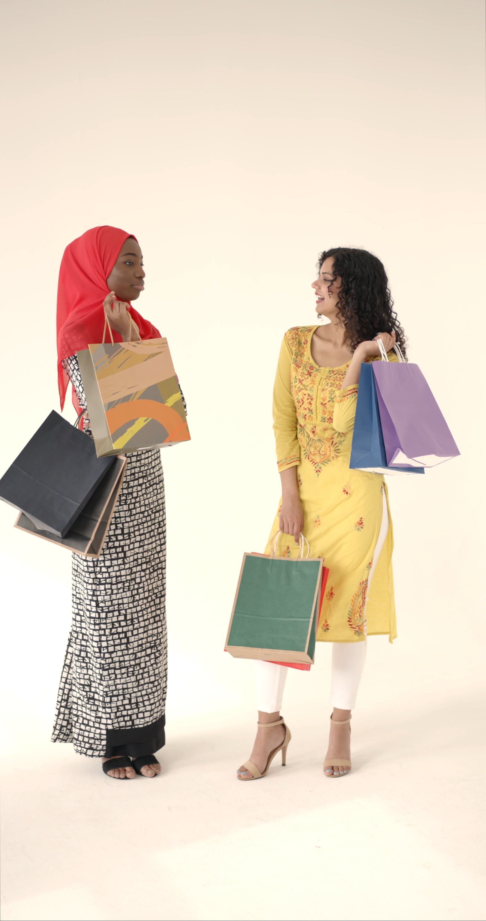 Women Carrying Shopping Bags Having a Good Conversation · Free Stock Video