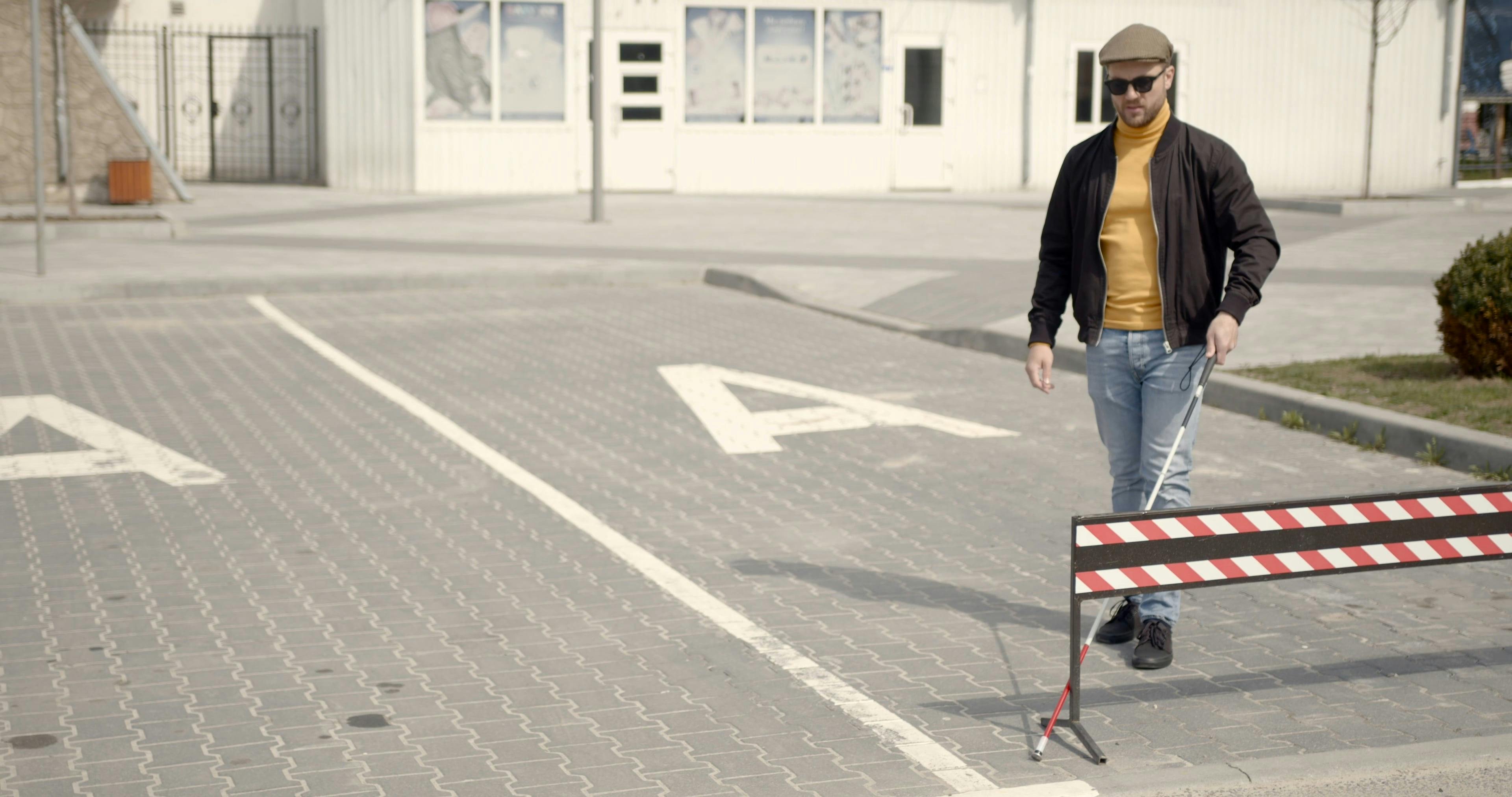 A Blind Man Walking Using His White Cane · Free Stock Video