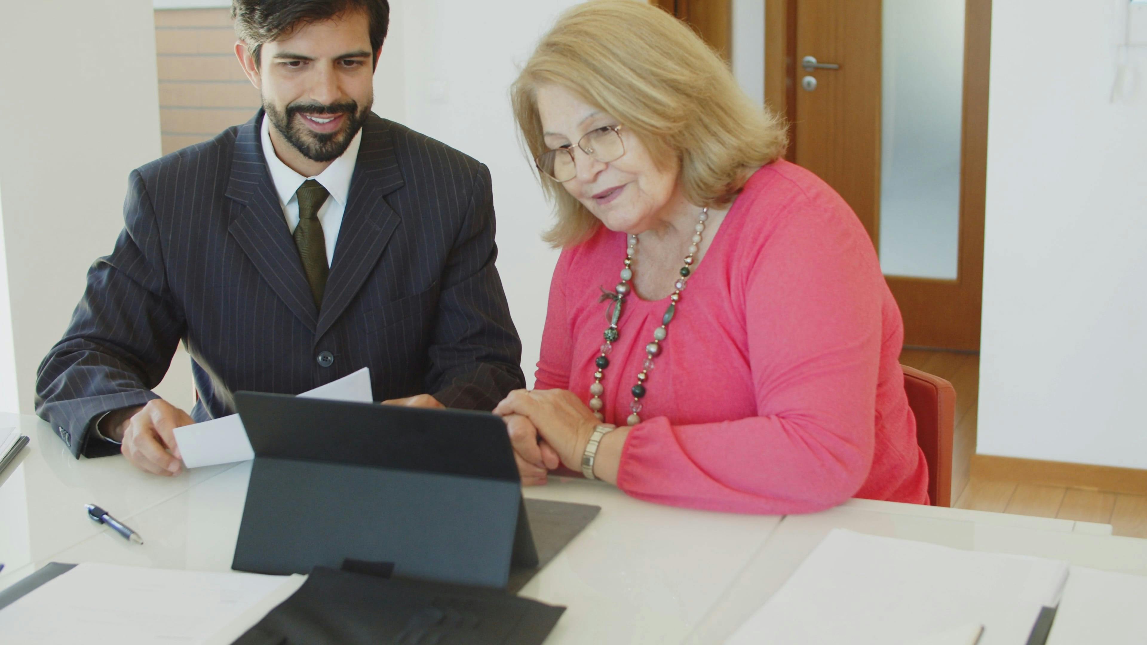 Realtor Talking to His Client Using Digital Tablet · Free Stock Video