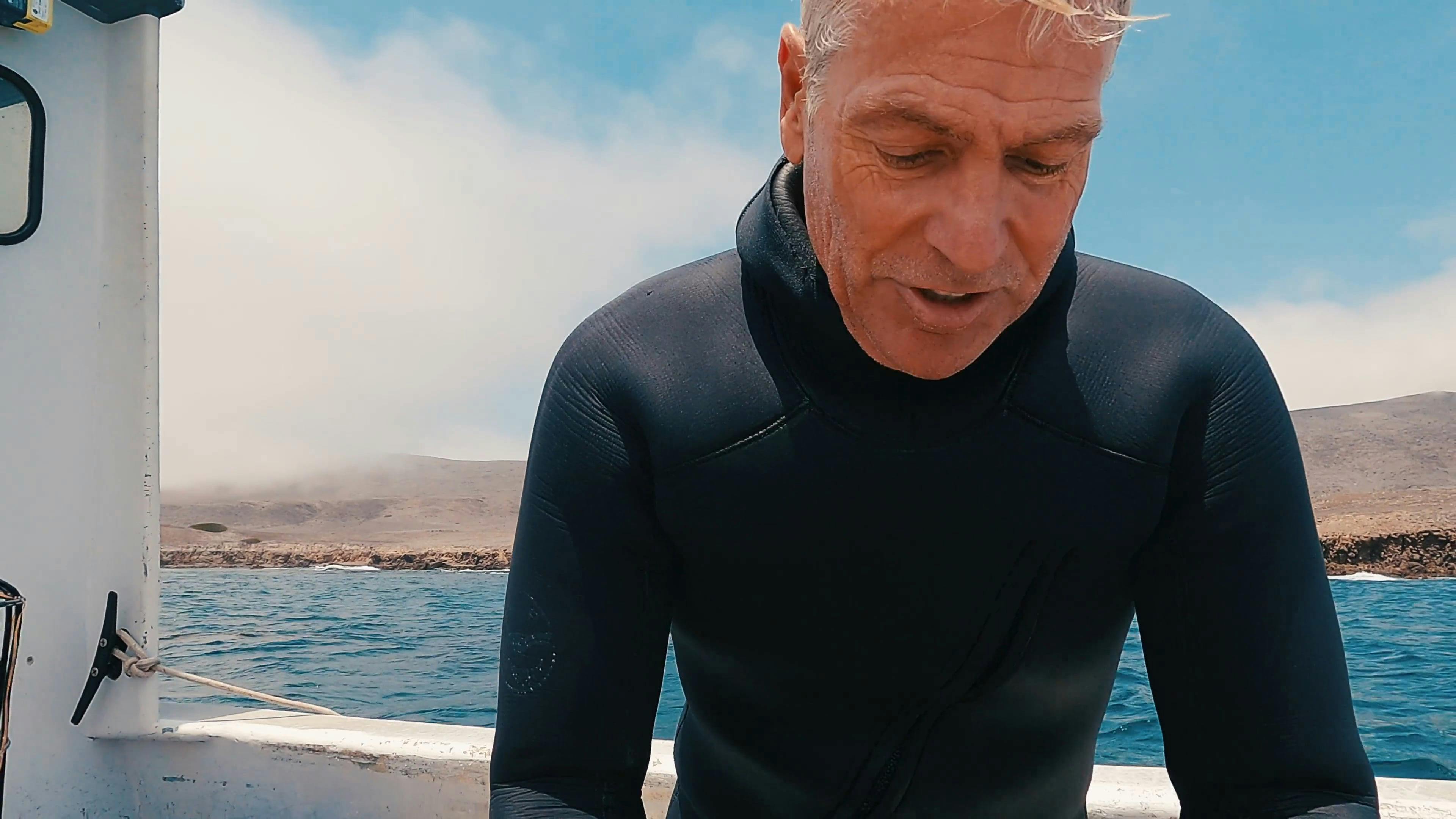 A Diver Placing his Catch under the Deck of a Boat Free Stock Video ...