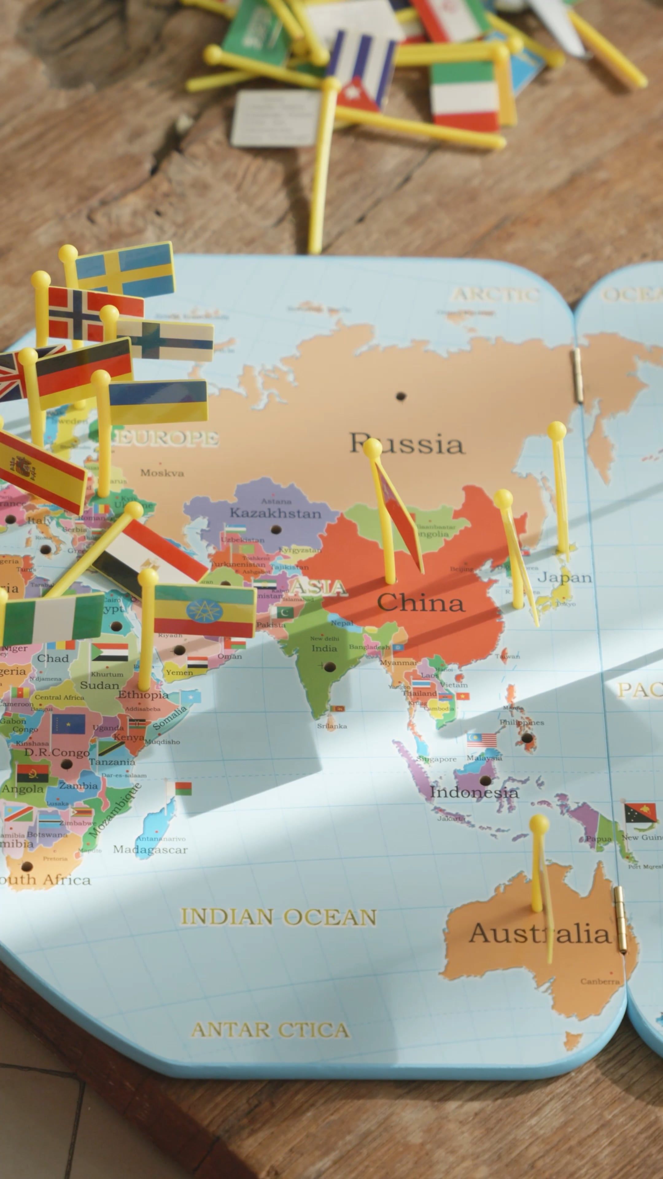 Tracking Shot of a World Map with Small Flags · Free Stock Video