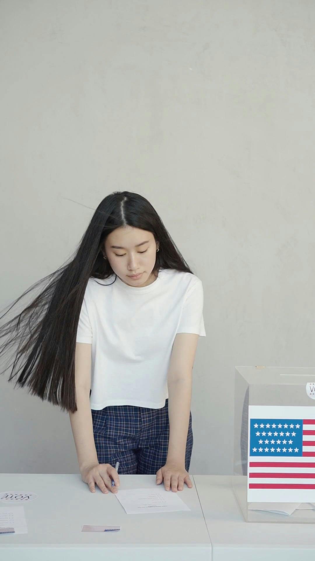 Woman Putting her Vote Choice on Ballot Box · Free Stock Video