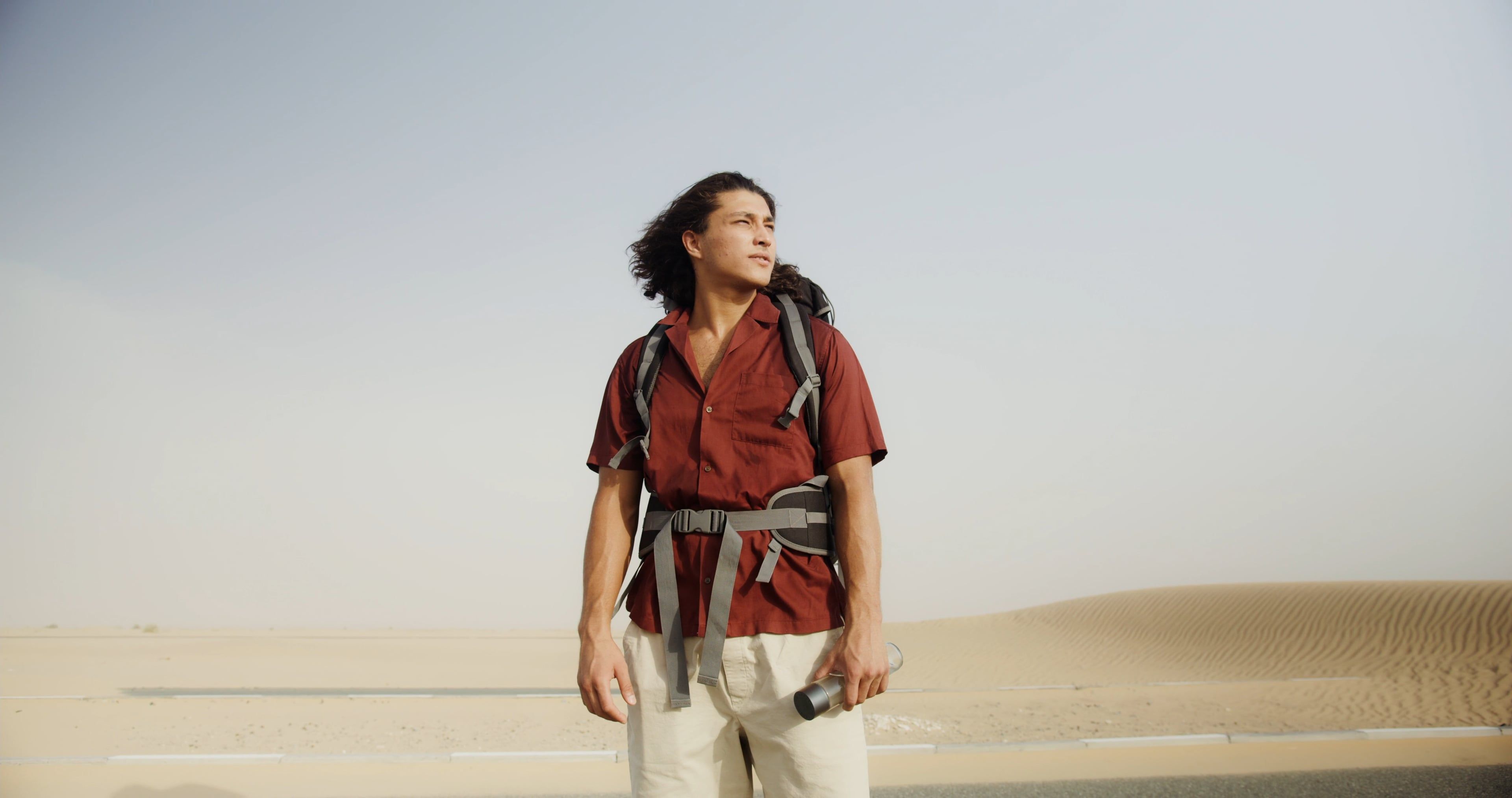 A Backpacker Standing on a Desert Free Stock Video Footage, Royalty ...