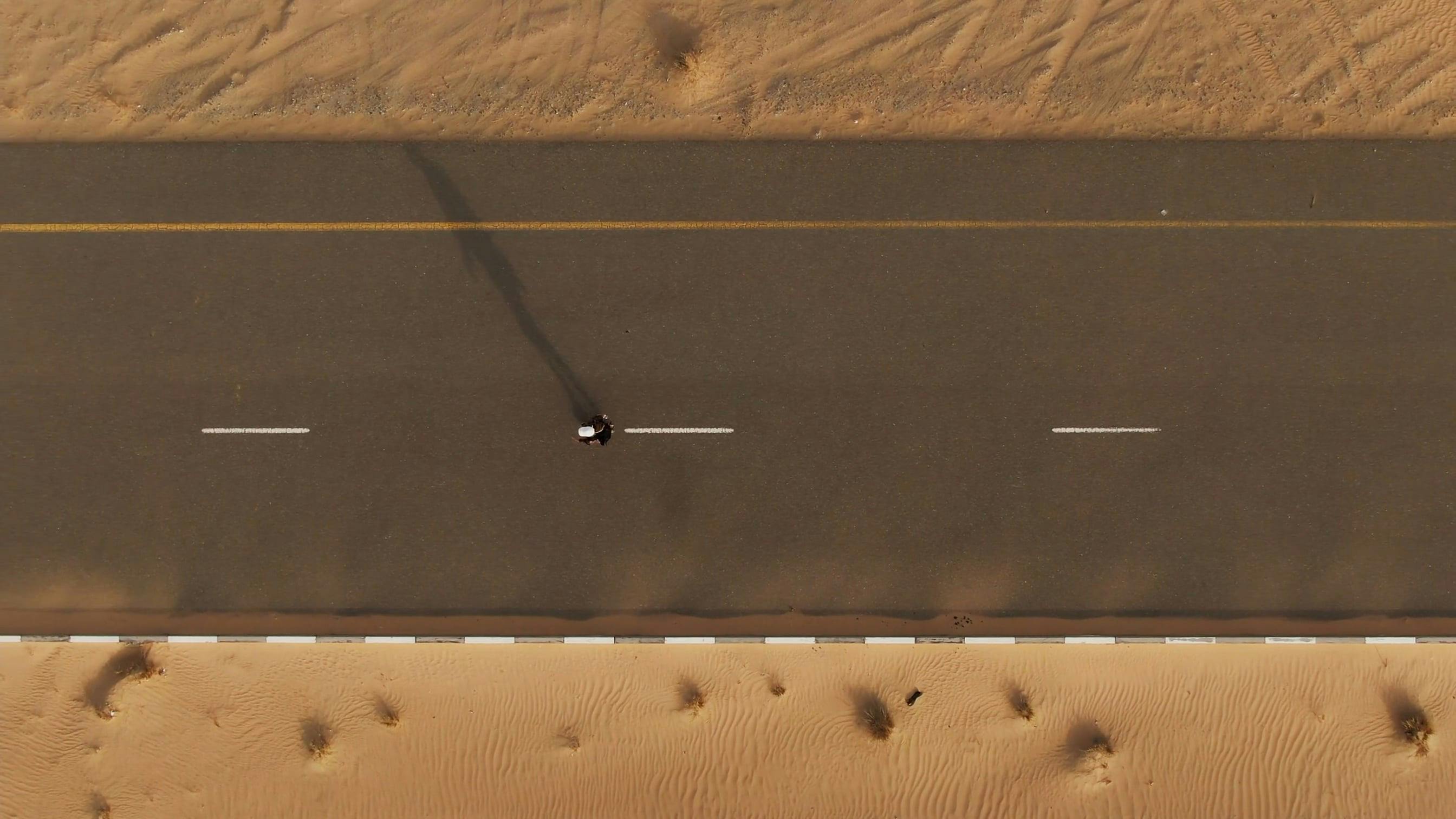Birds Eye View of a Person Walking on a Sandy Road Free Stock Video ...