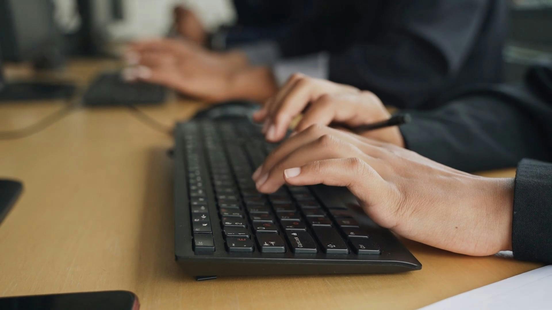 People Typing on a Computer Keyboard · Free Stock Video