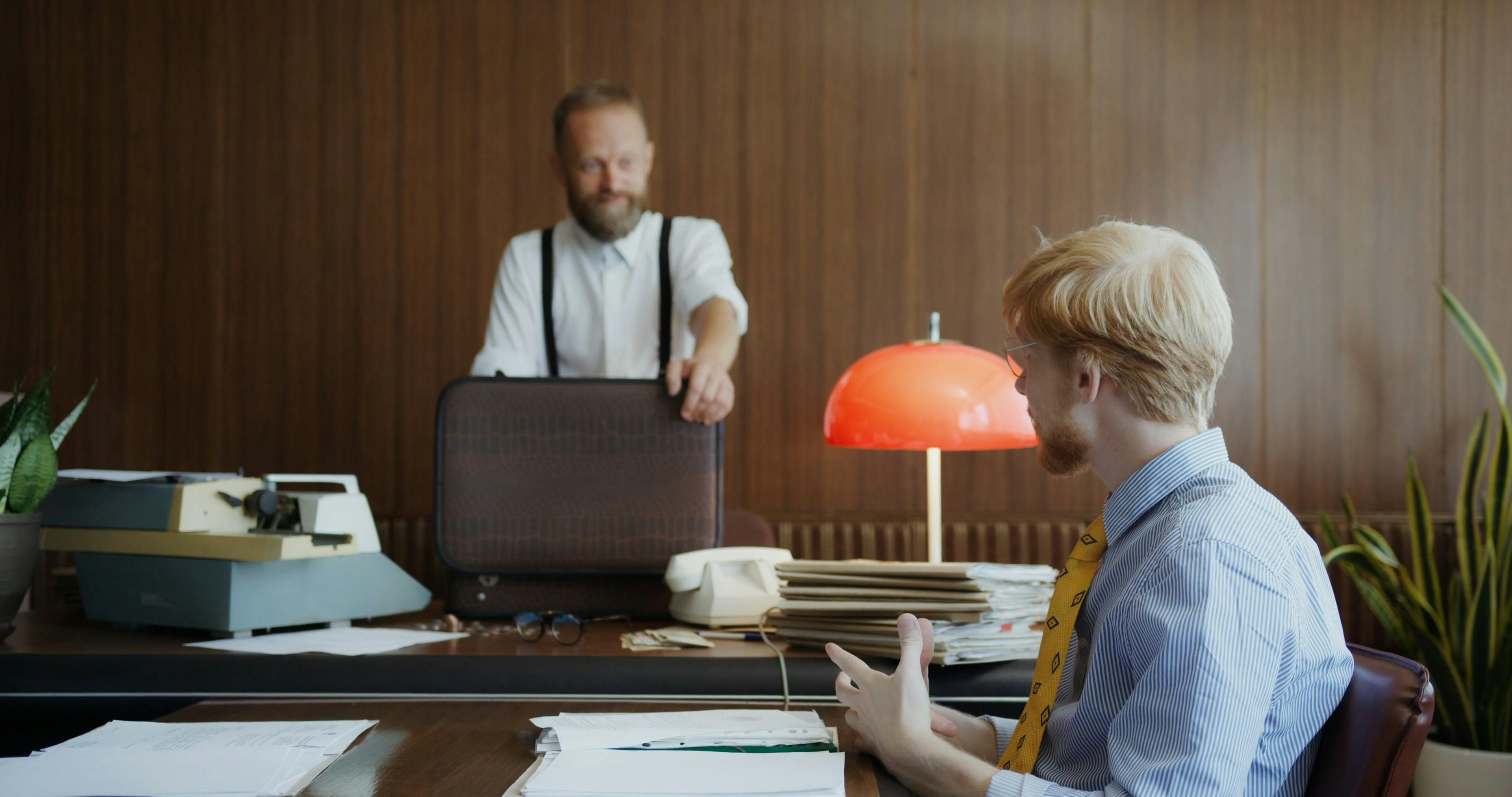 A Man Handing Documents to His Employee · Free Stock Video