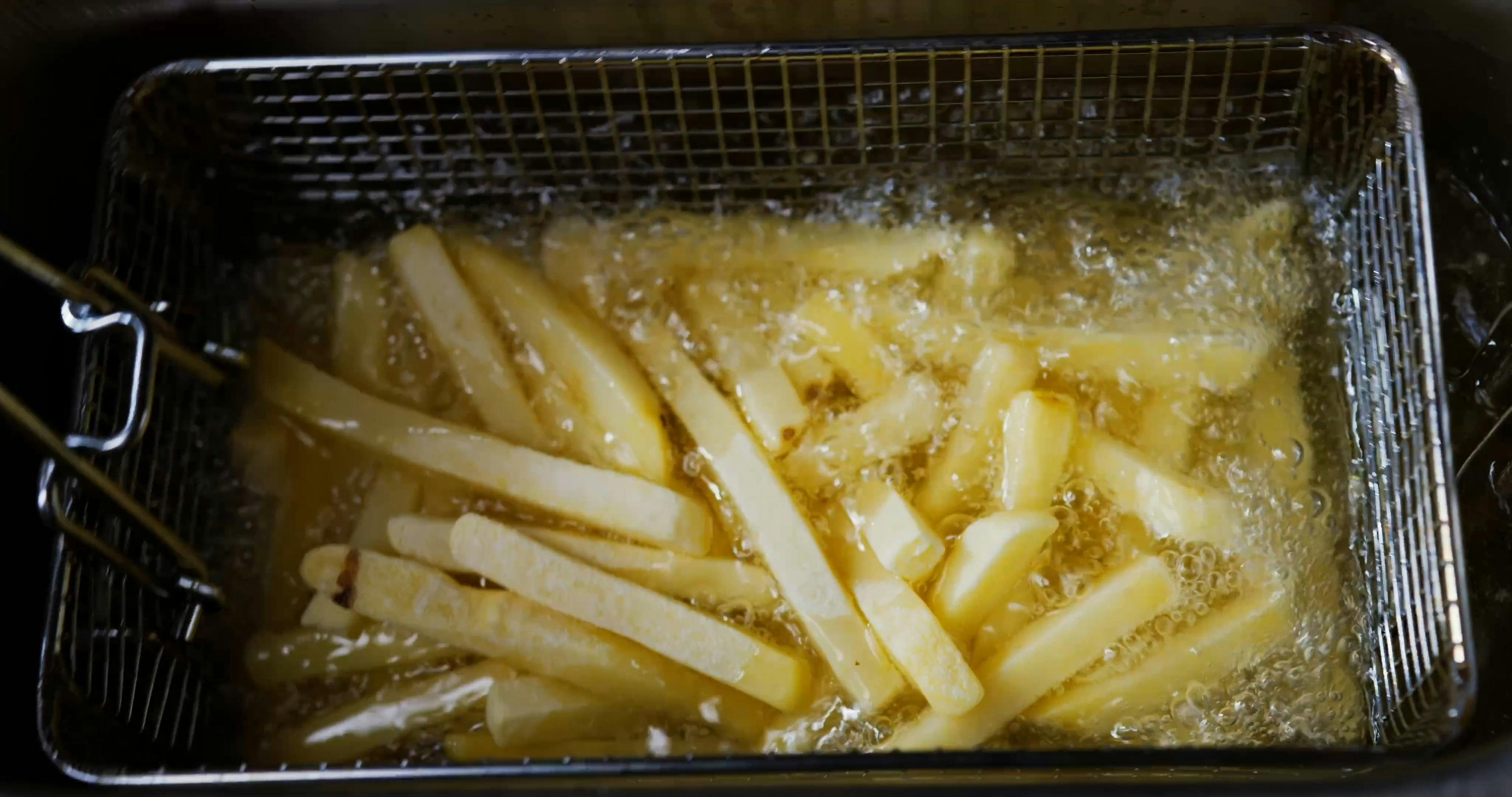 A Person Cooking French Fries Free Stock Video Footage, Royalty-Free 4K ...