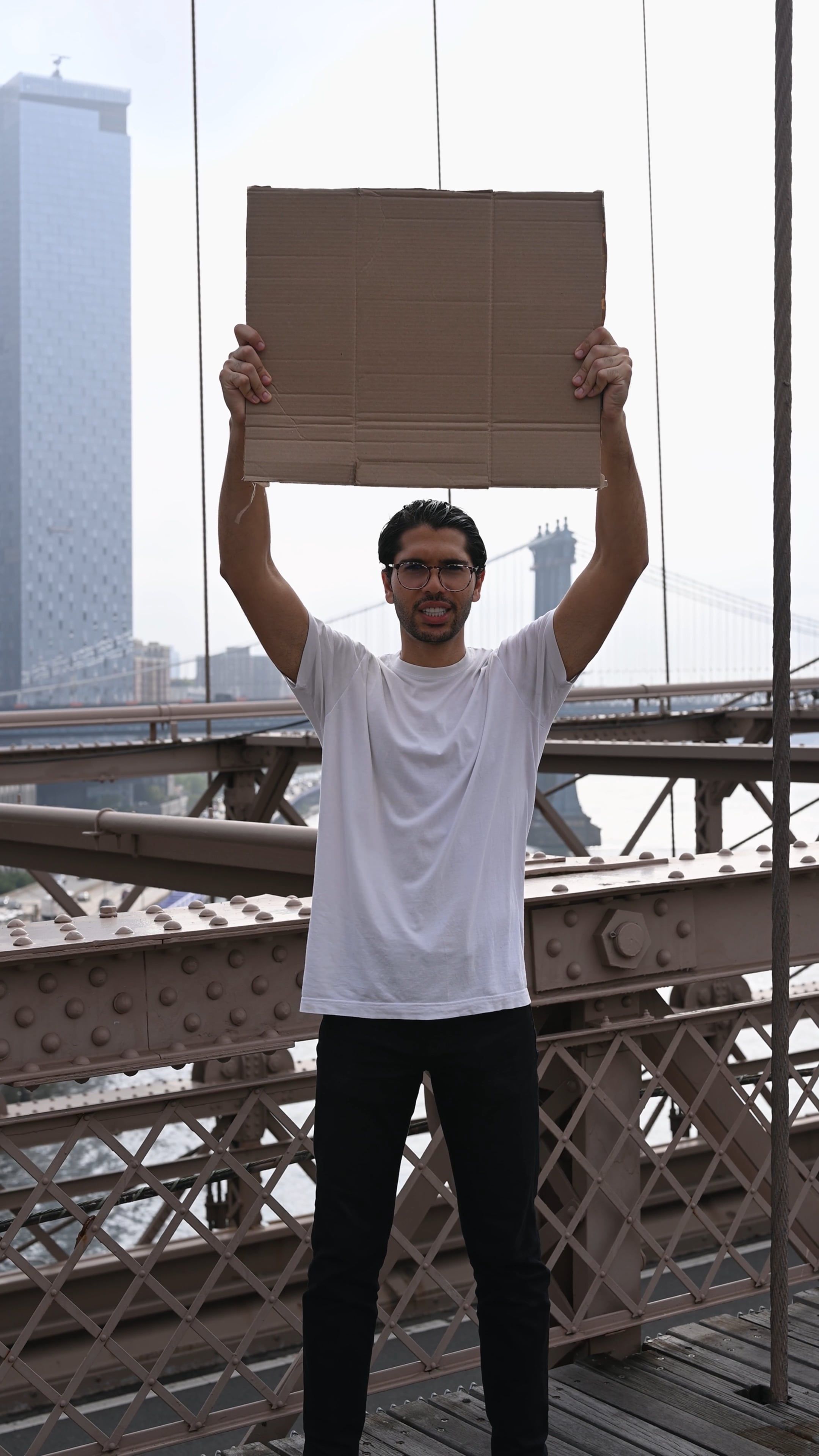 A Man Standing while Holding a Cardboard Free Stock Video Footage ...