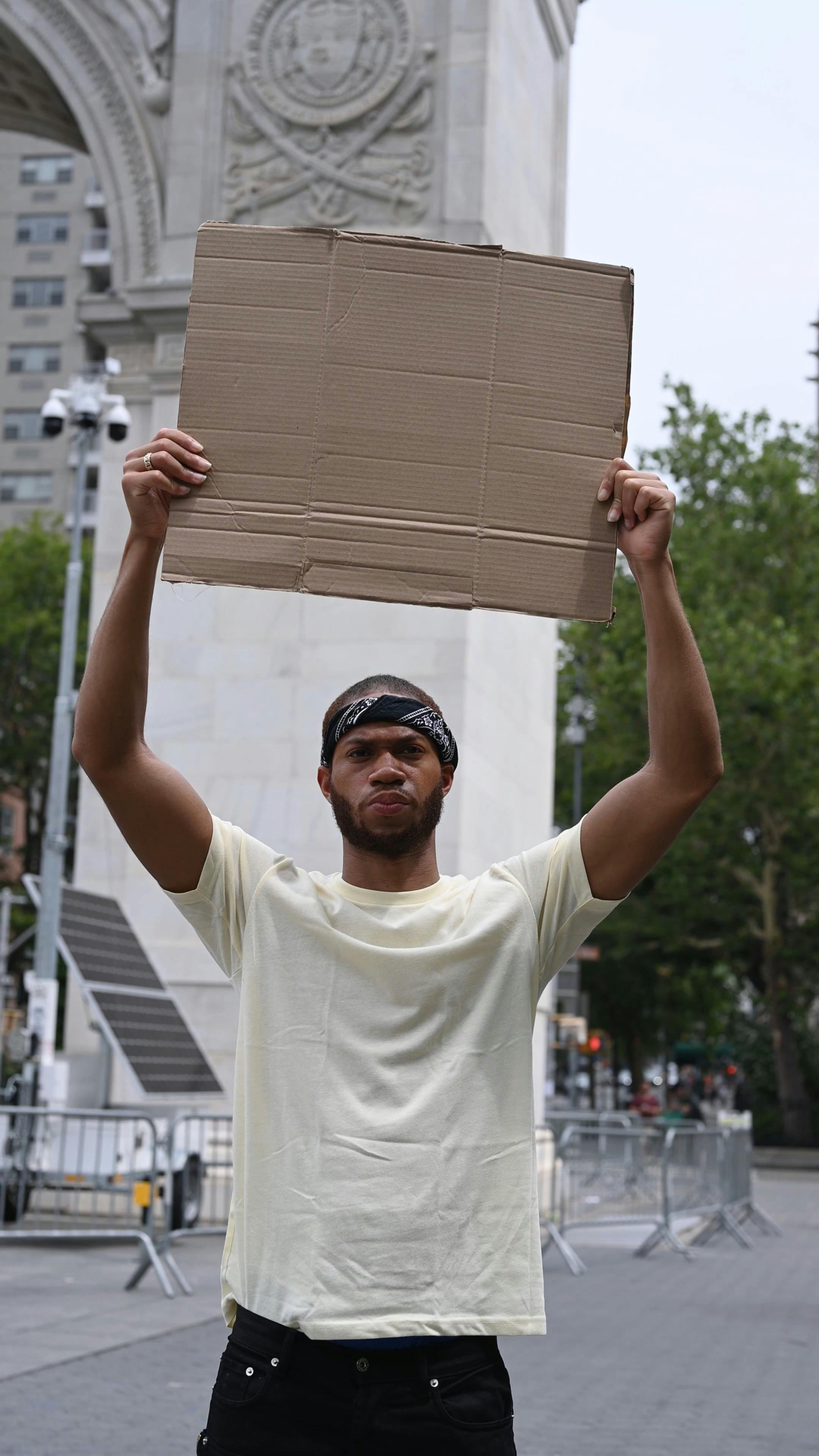 A Man Holding a Placard · Free Stock Video