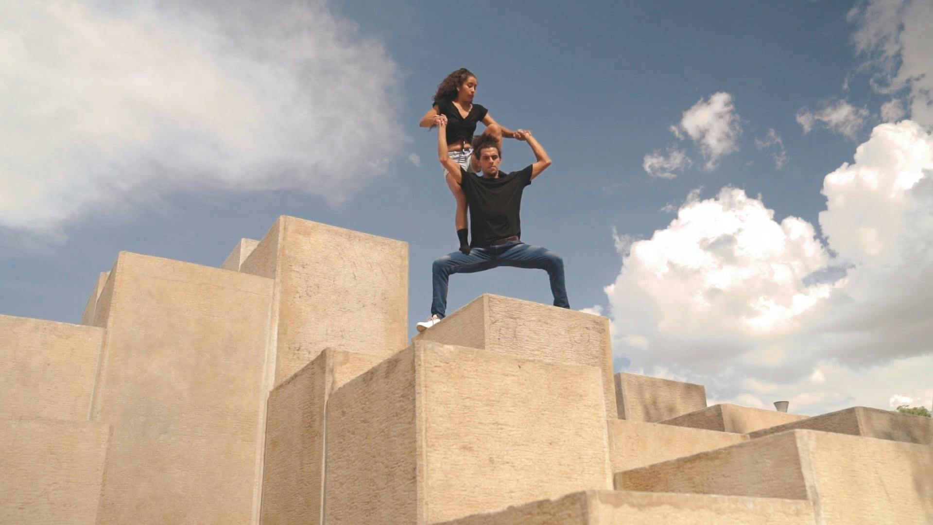 Couple doing Acro Yoga