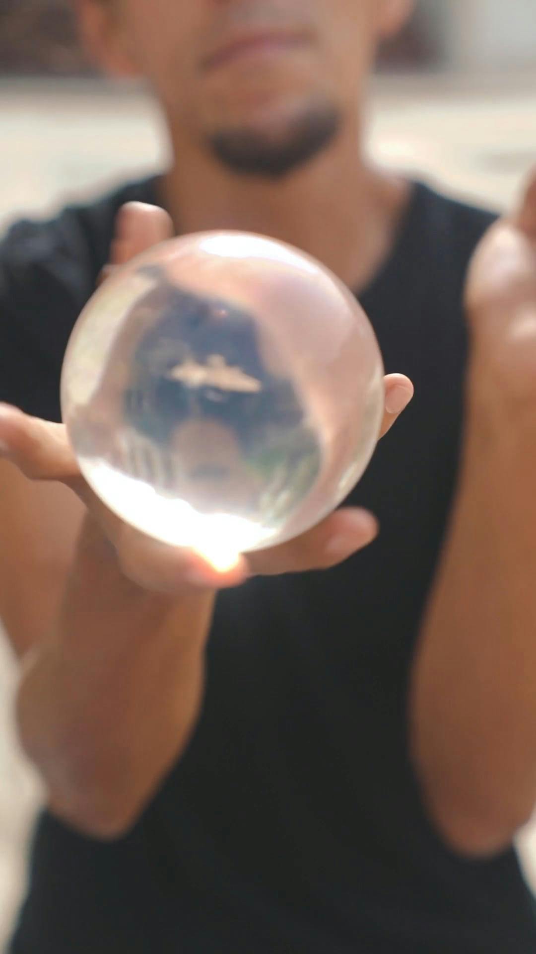 A Man Touching a Floating Crystal Ball · Free Stock Video