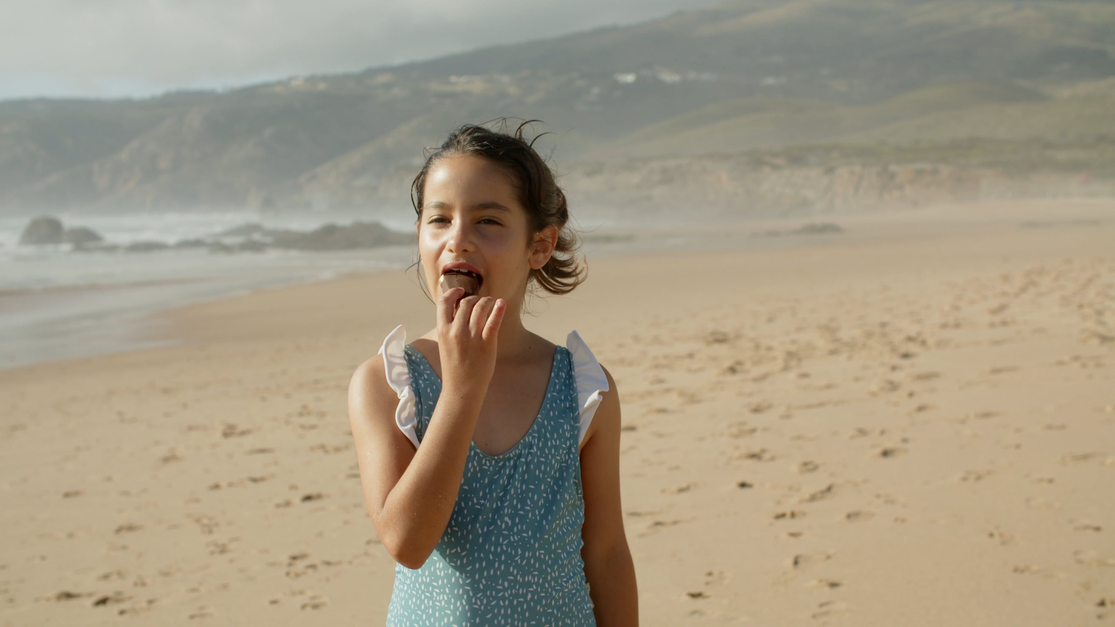 Girl Eating while Walking on Beach Free Stock Video Footage, Royalty ...
