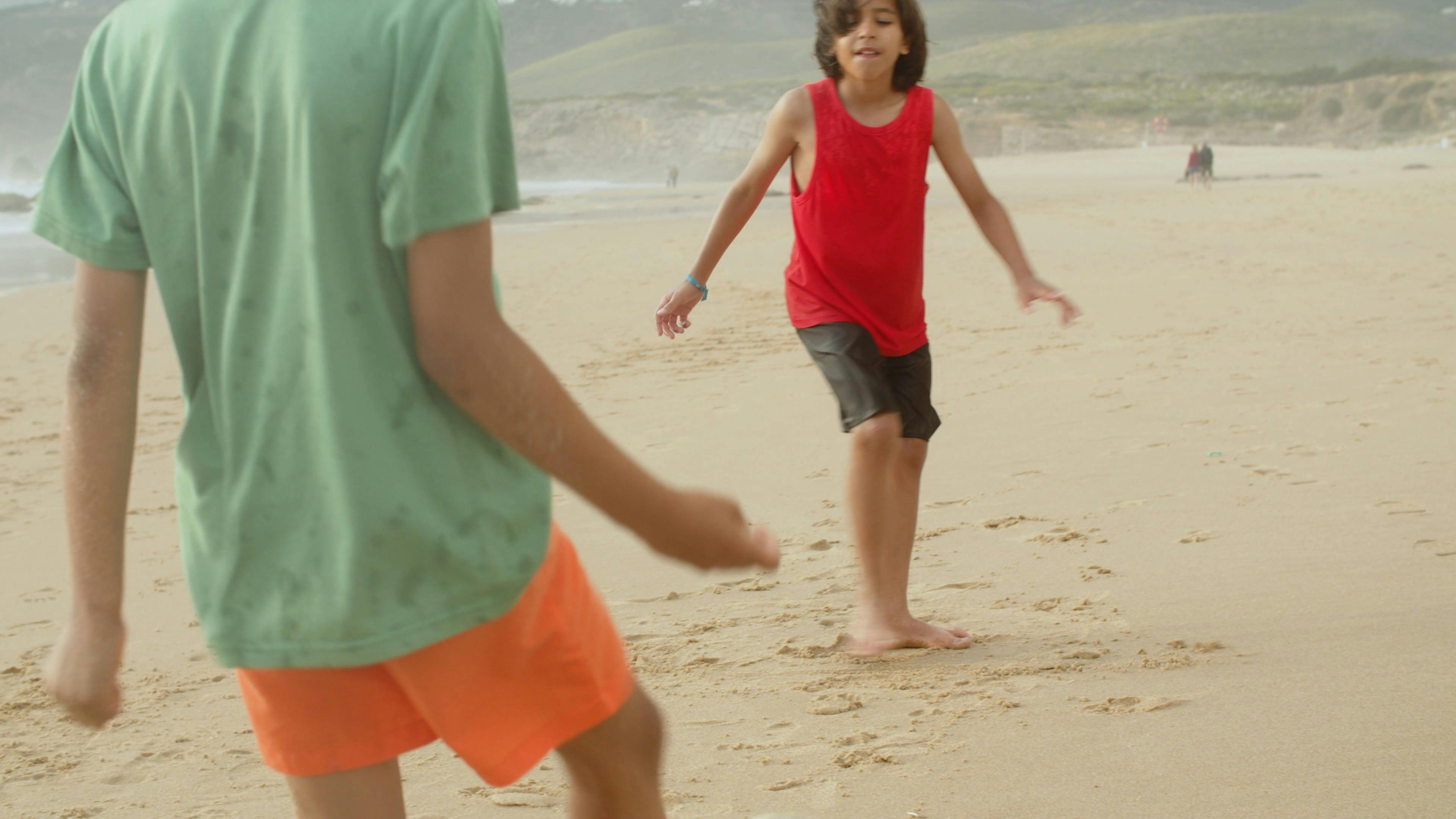 Playing Kickball At The Beach During Sunset Free Stock Video Footage ...