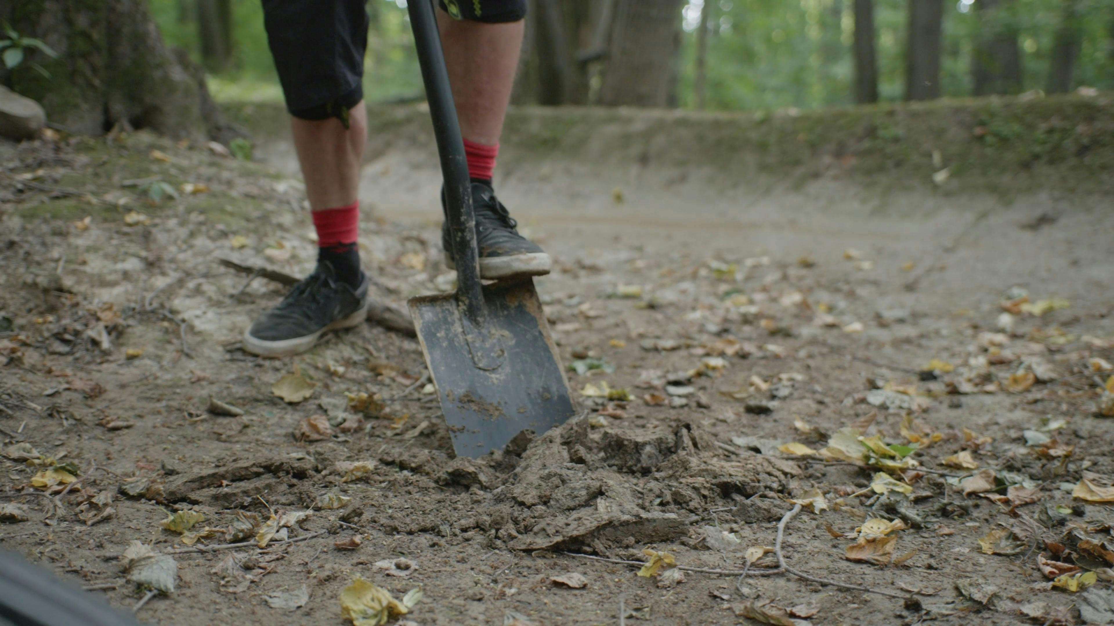 A Person Digging A Hole On The Ground With A Shovel · Free Stock Video