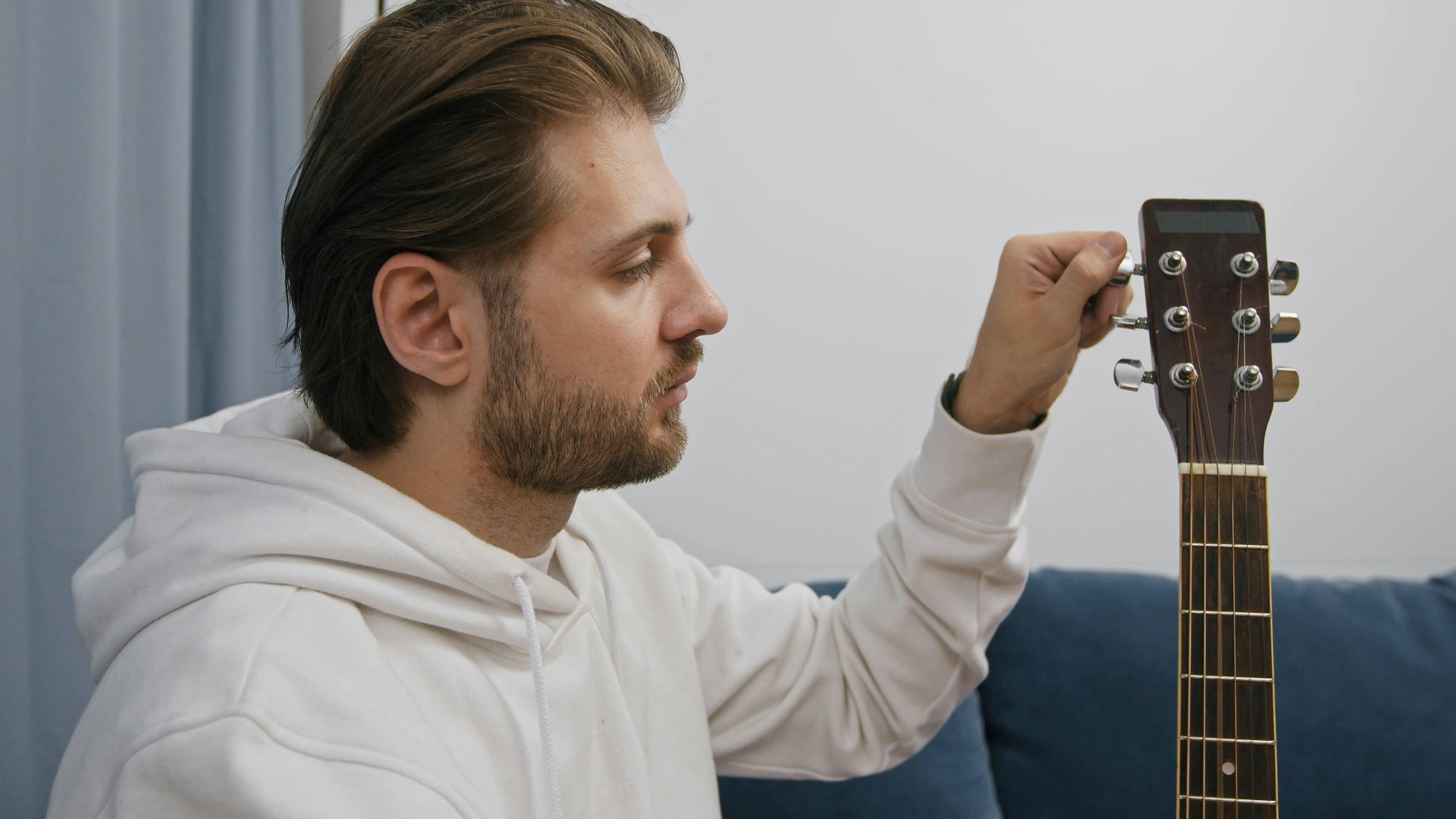 A Man Tuning a Guitar Free Stock Video Footage, Royalty-Free 4K & HD ...