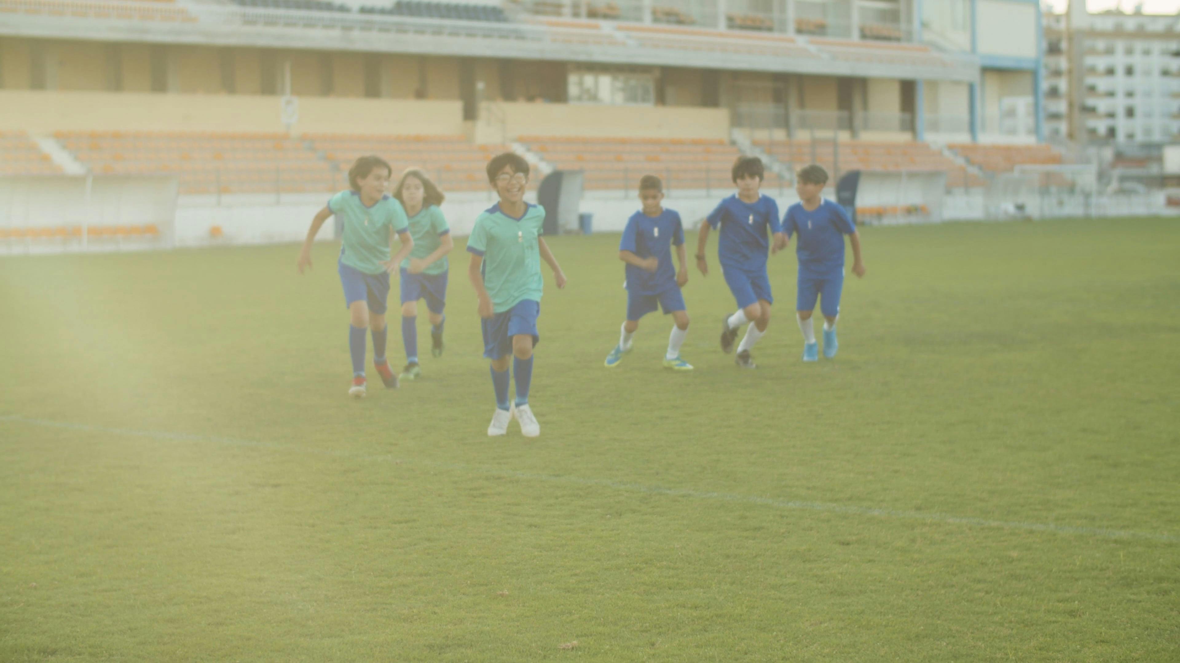 Boys Running at the Football Field Together Free Stock Video Footage ...