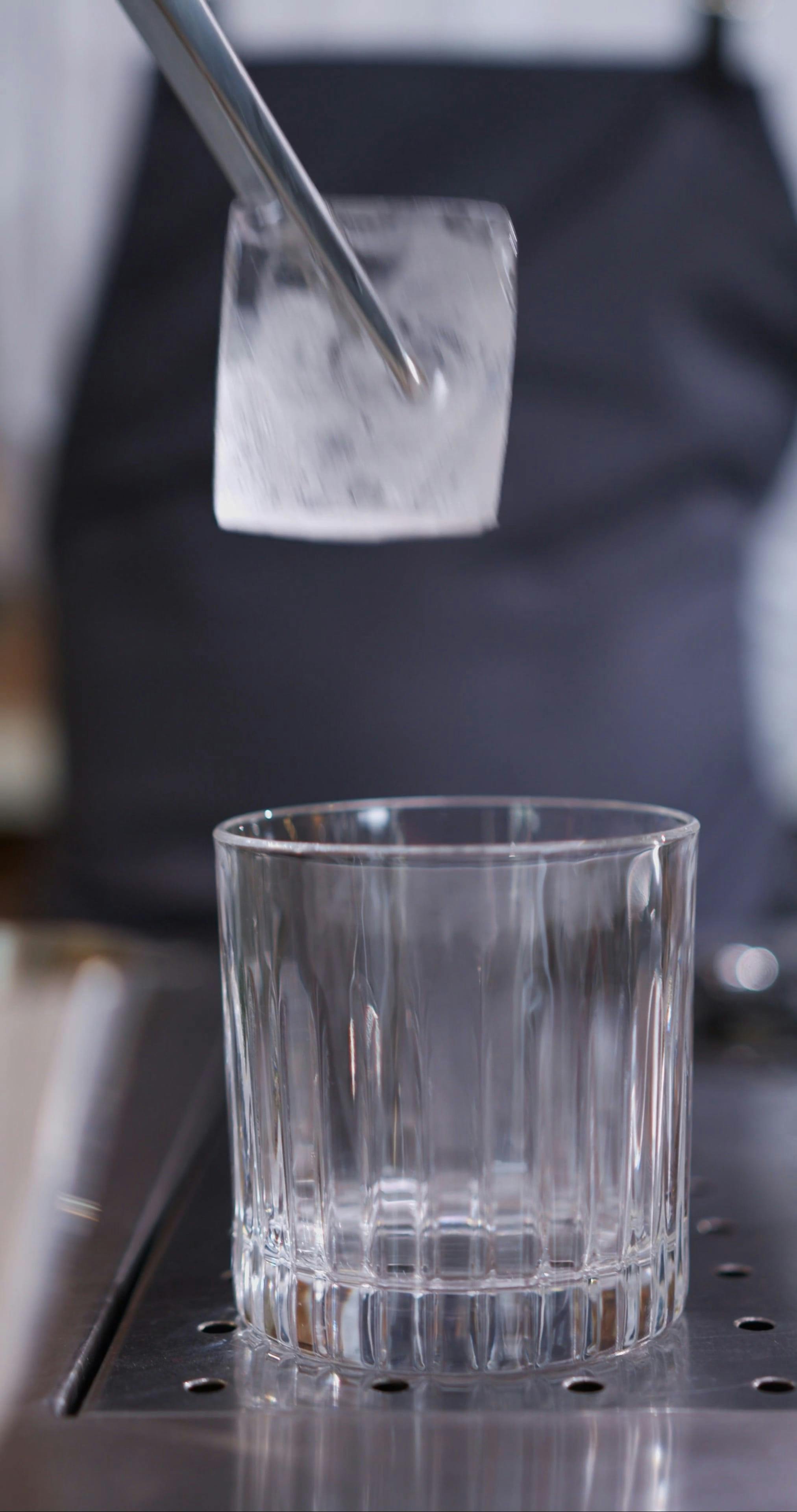Bartender Putting an Ice Cube into a Glass · Free Stock Video