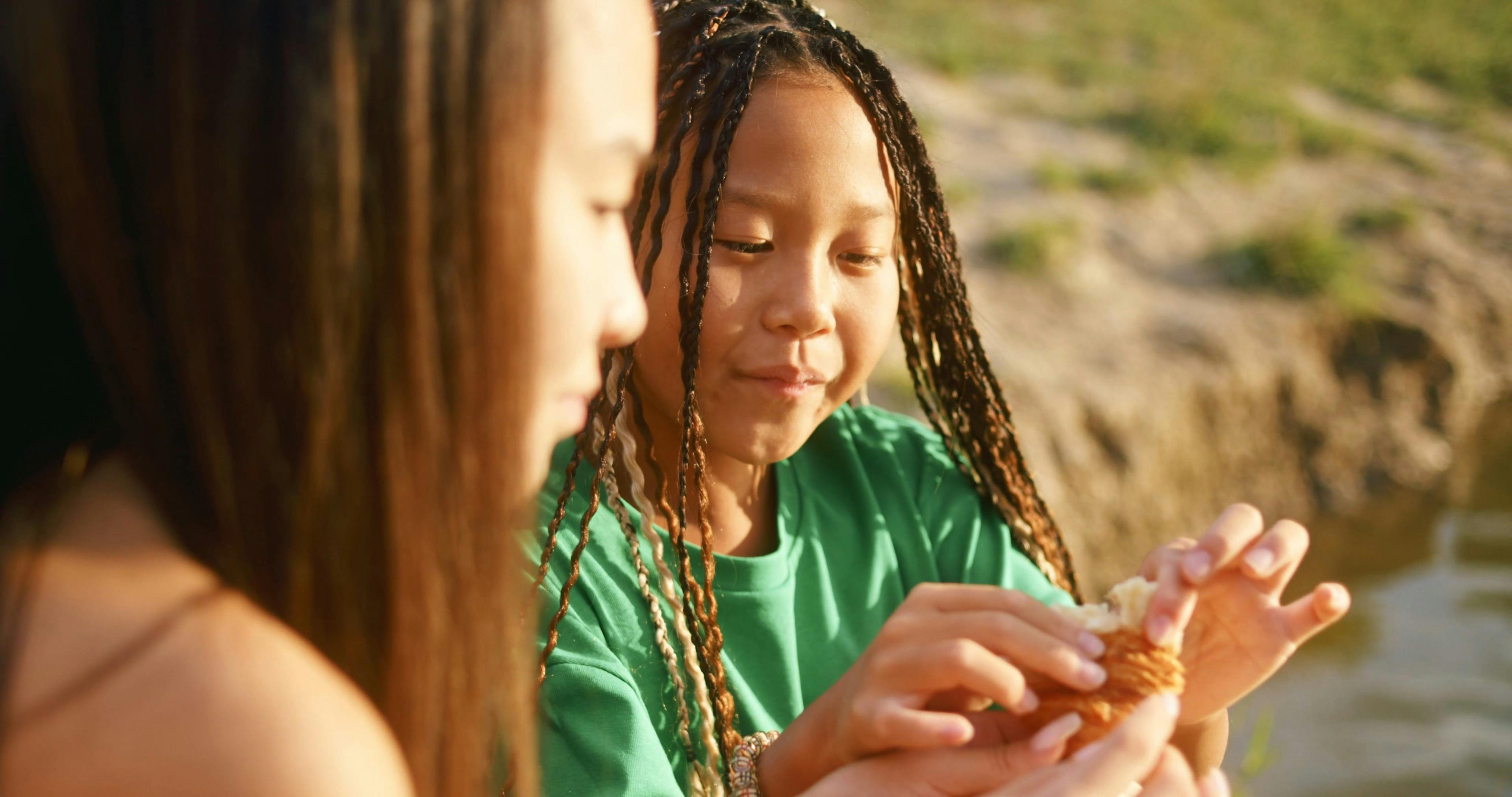 A Girl Throwing a Piece of Bread on a Pond Free Stock Video Footage ...