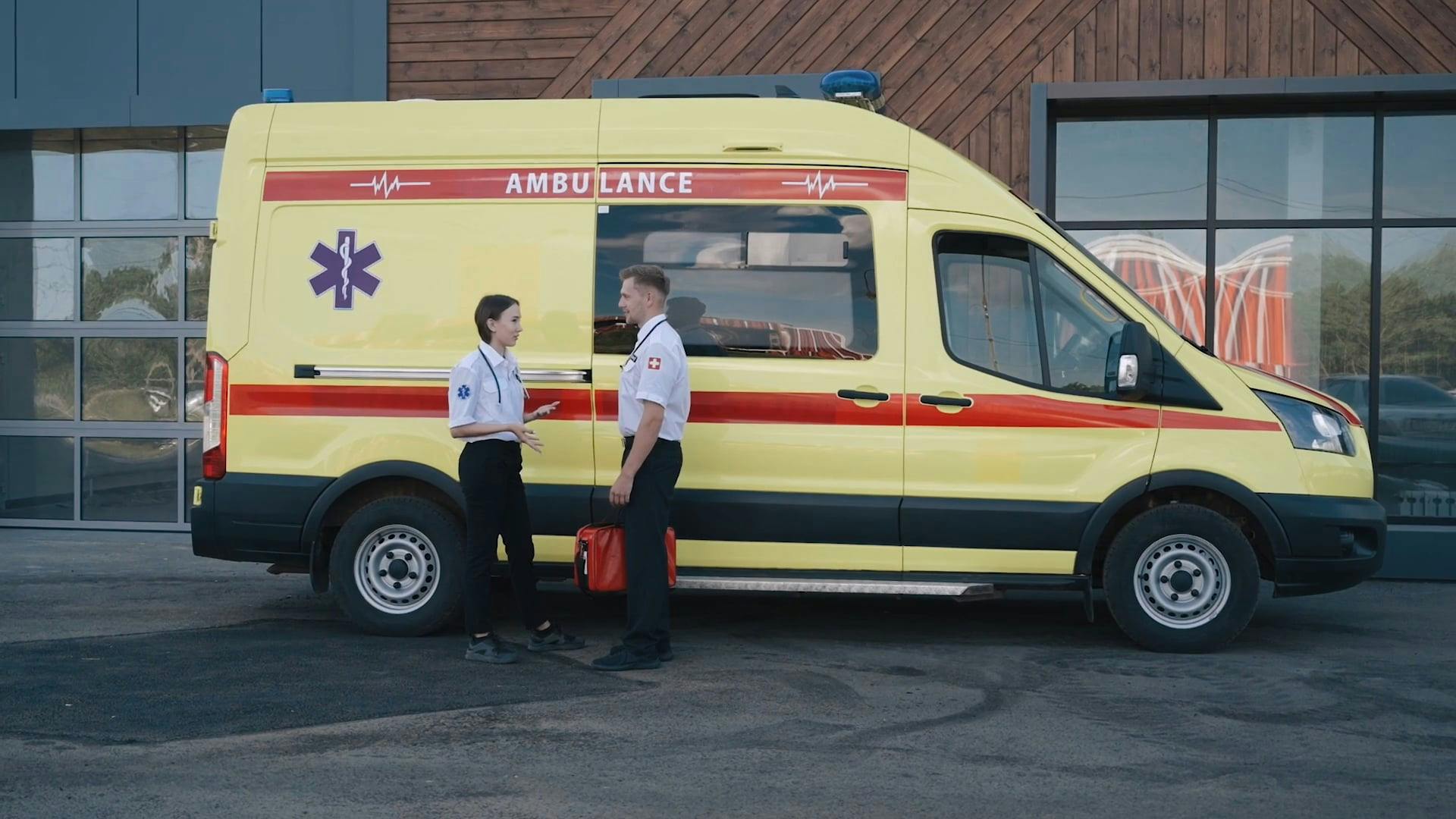 Paramedics Talking Beside an Ambulance · Free Stock Video