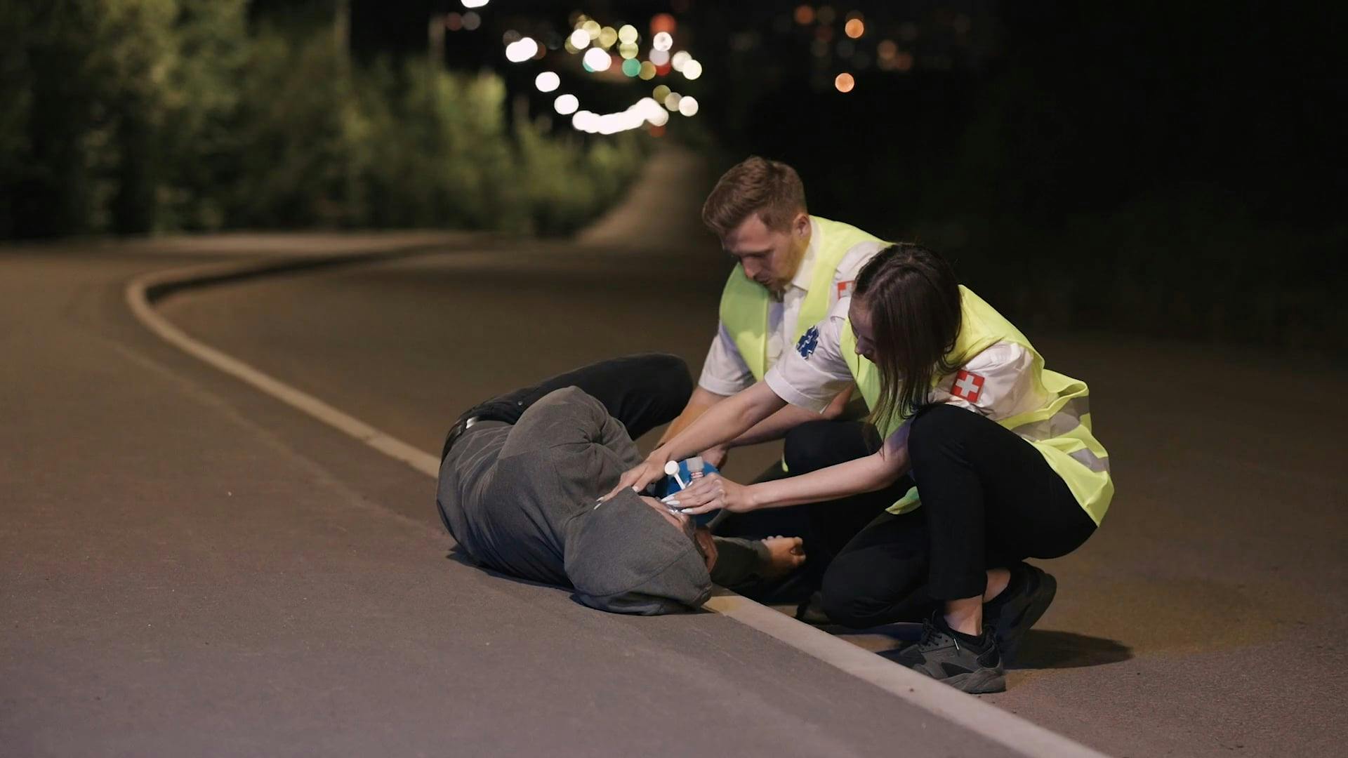 People Rescuing a Man Lying on Street Free Stock Video Footage, Royalty ...