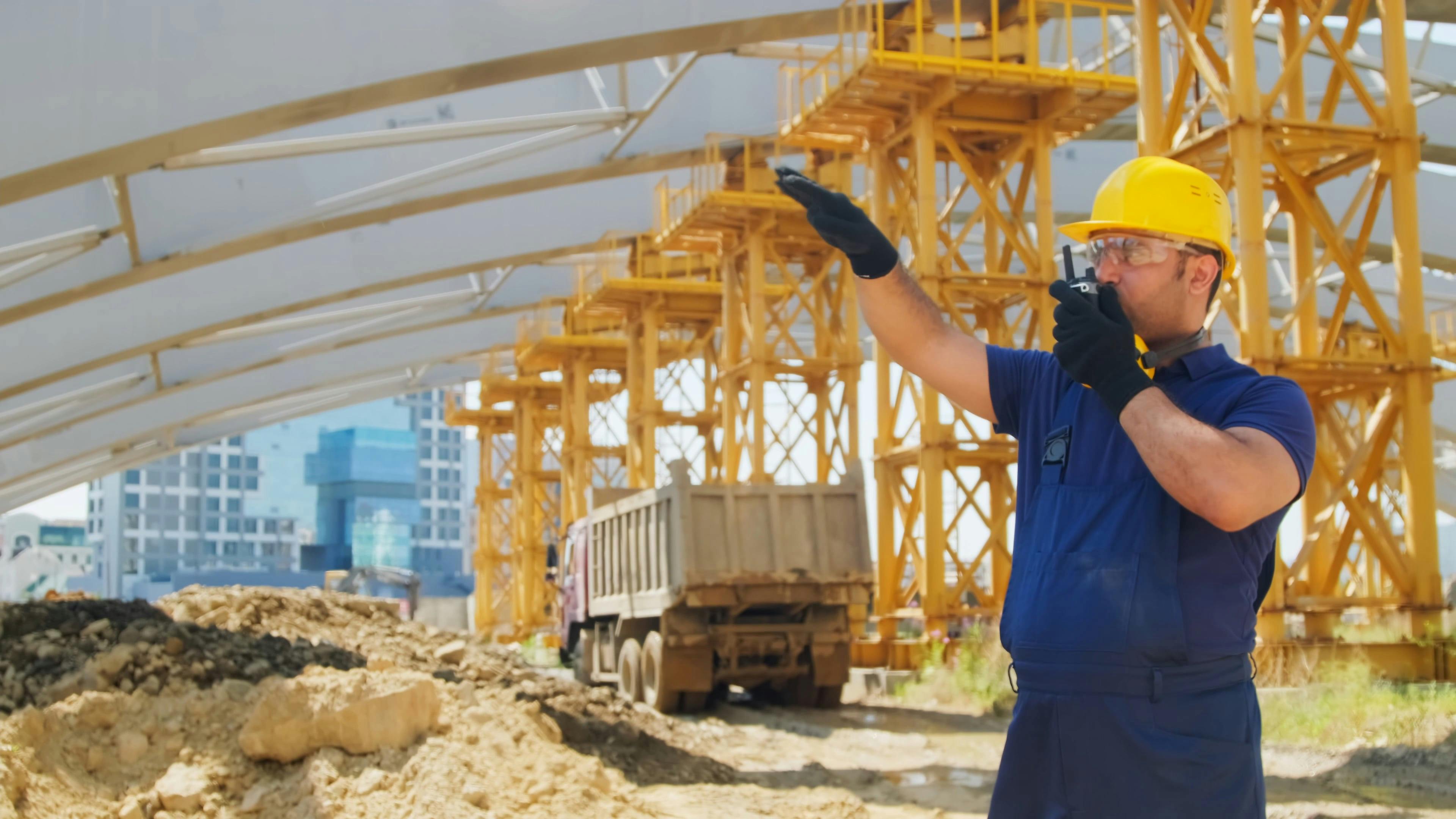 A Man in a Construction Site Using Walkie Talkie Free Stock Video ...