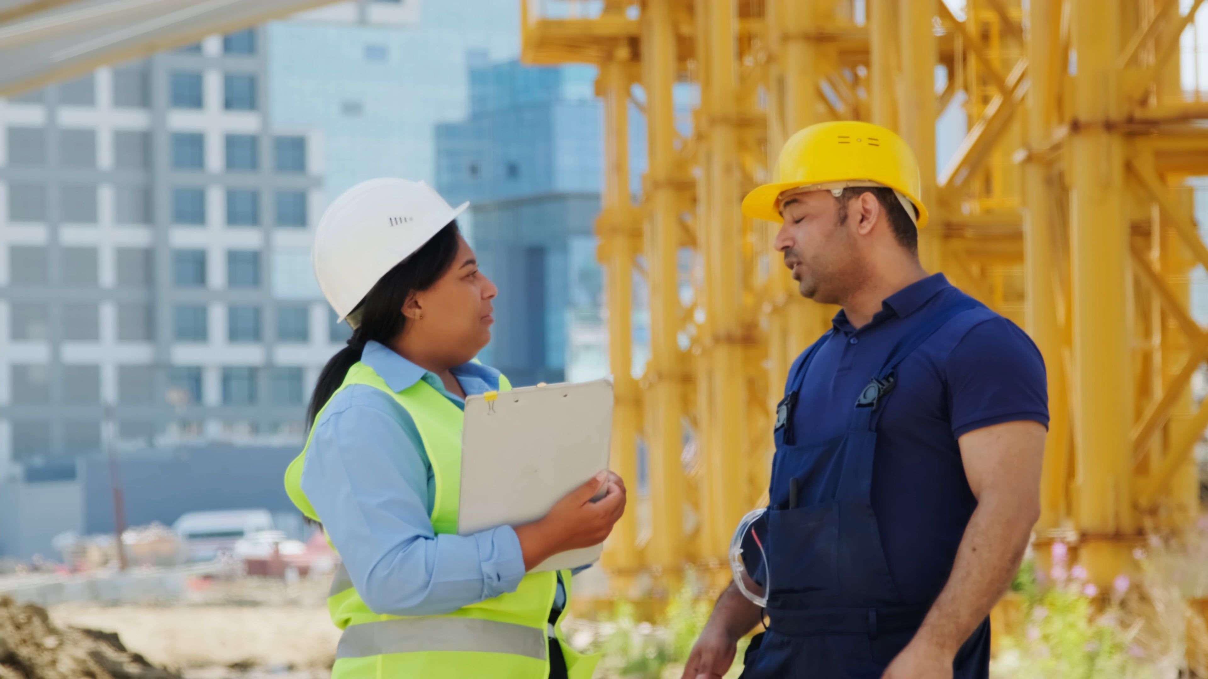 A Man and Woman Having Conversation at the Construction Site · Free ...