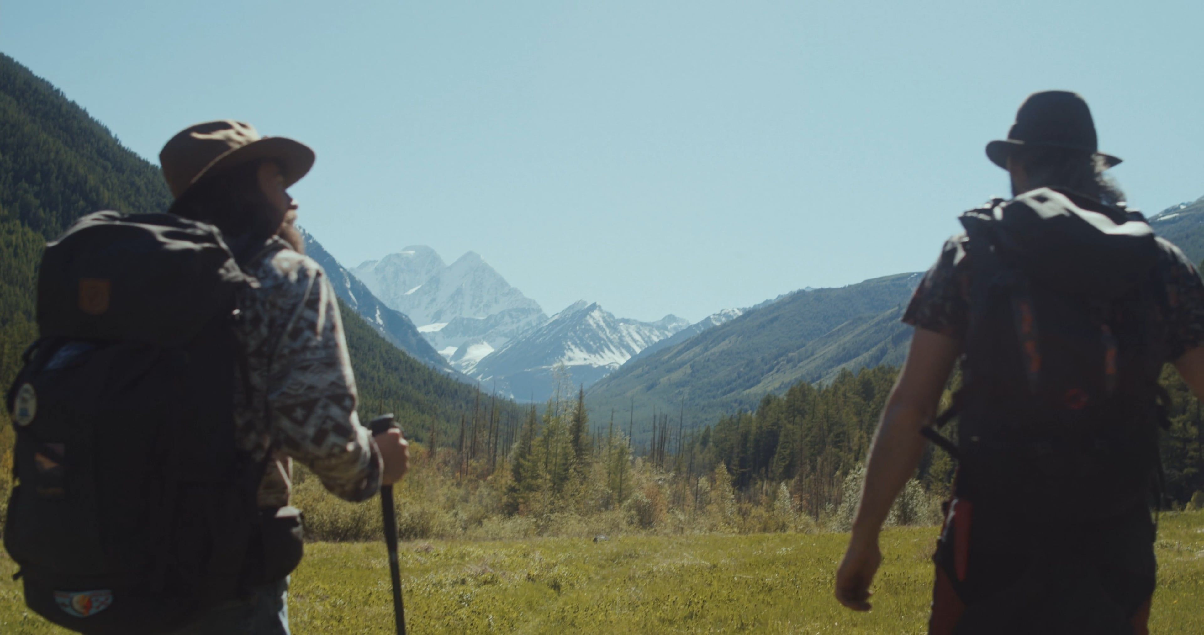 Back View of Two Men Walking in a Valley Free Stock Video Footage ...
