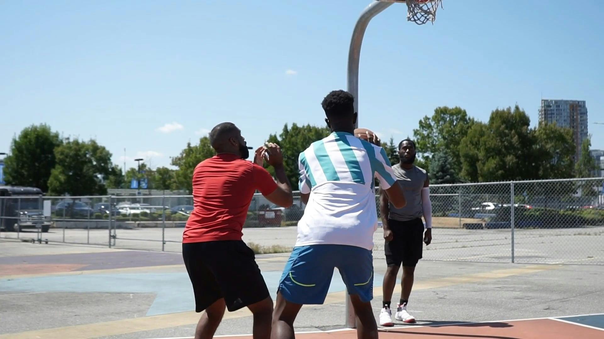 A Man Teaching His Friend How to Shoot a Ball Free Stock Video Footage ...