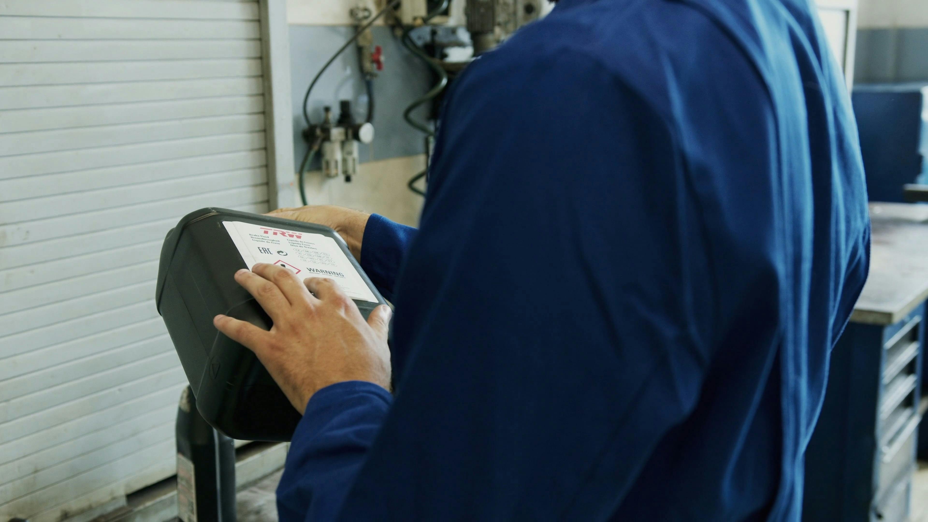 A Person Reading the Label of a Plastic Container · Free Stock Video